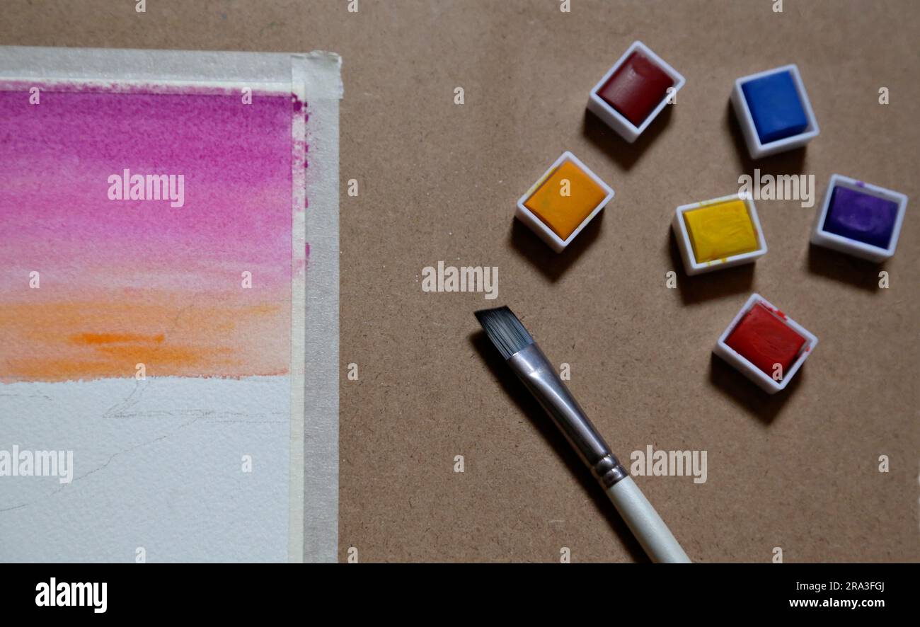 watercolor painting set with brush and colors swatches (taped down ...
