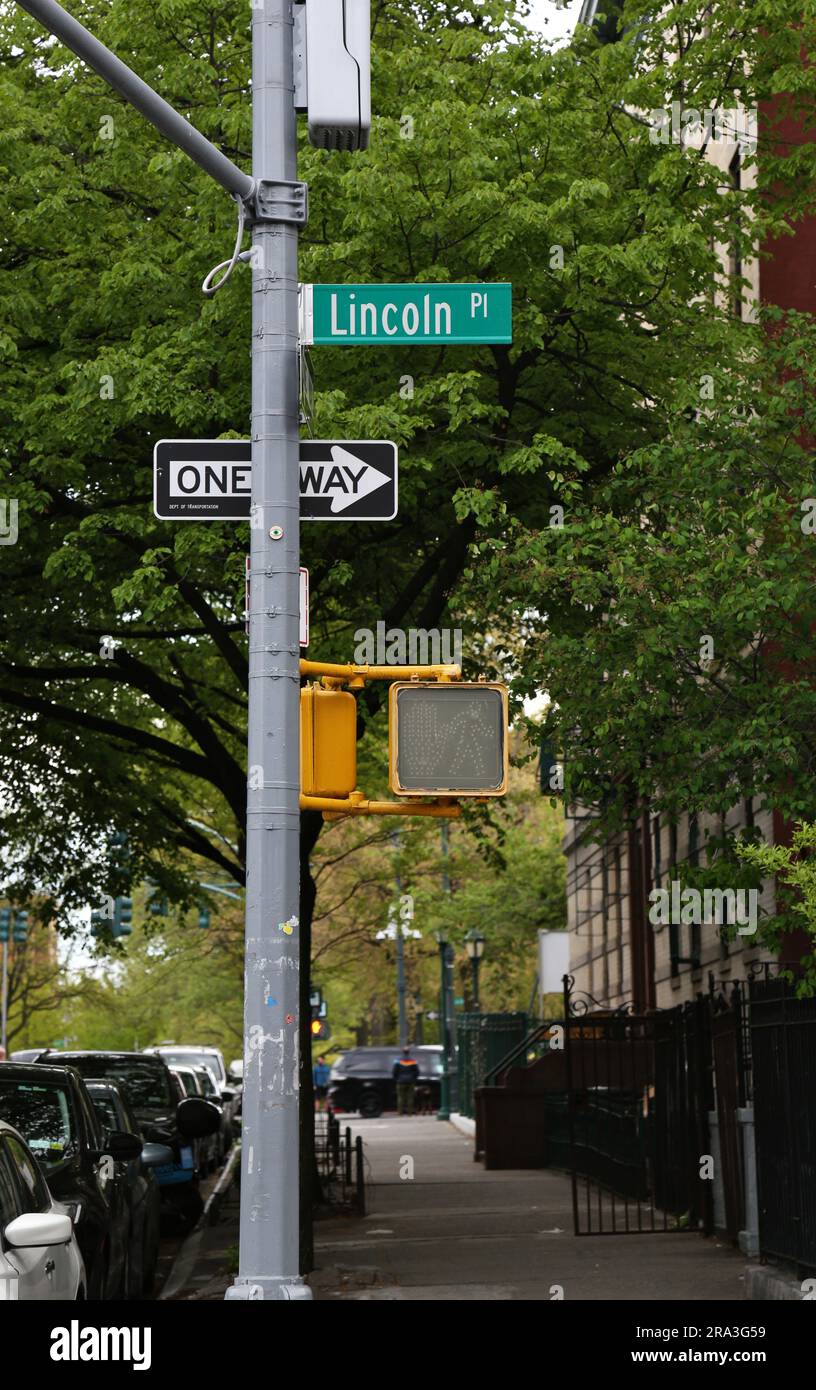 lincoln place, brooklyn street sign with traffic light and tree ...
