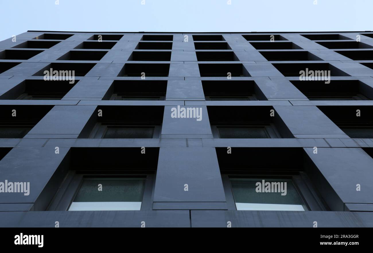 tall building facade (view looking up) modern apartment housing and ...