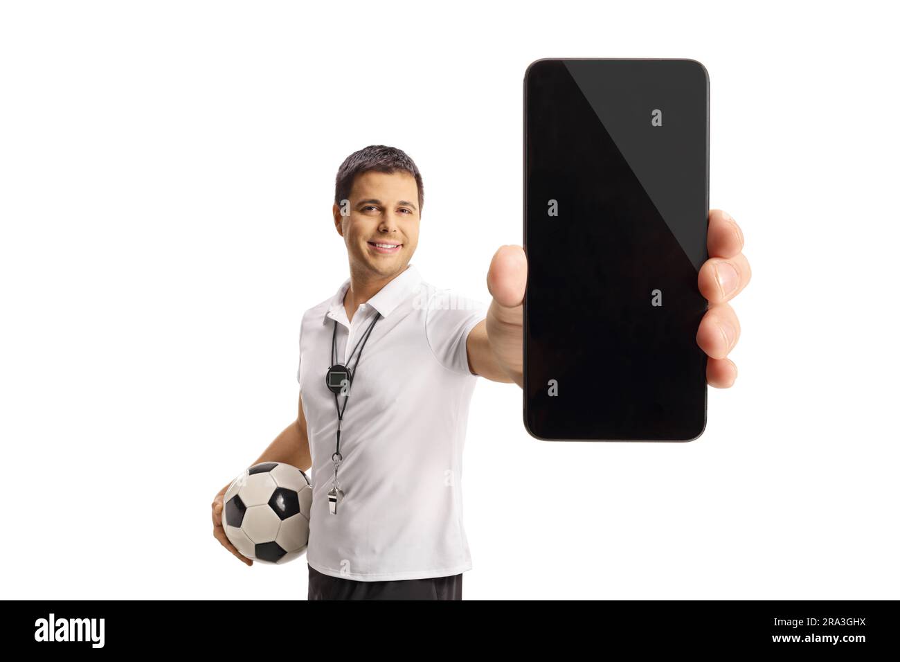 Football coach holding a ball and showing a smartphone isolated on ...