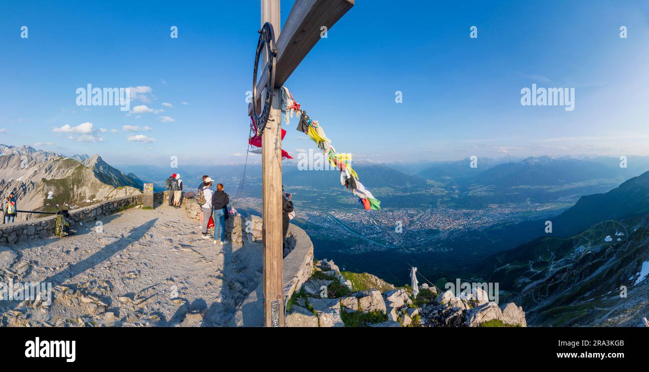 Innsbruck: summit cross on summit Hafelekarspitze, mountain range ...