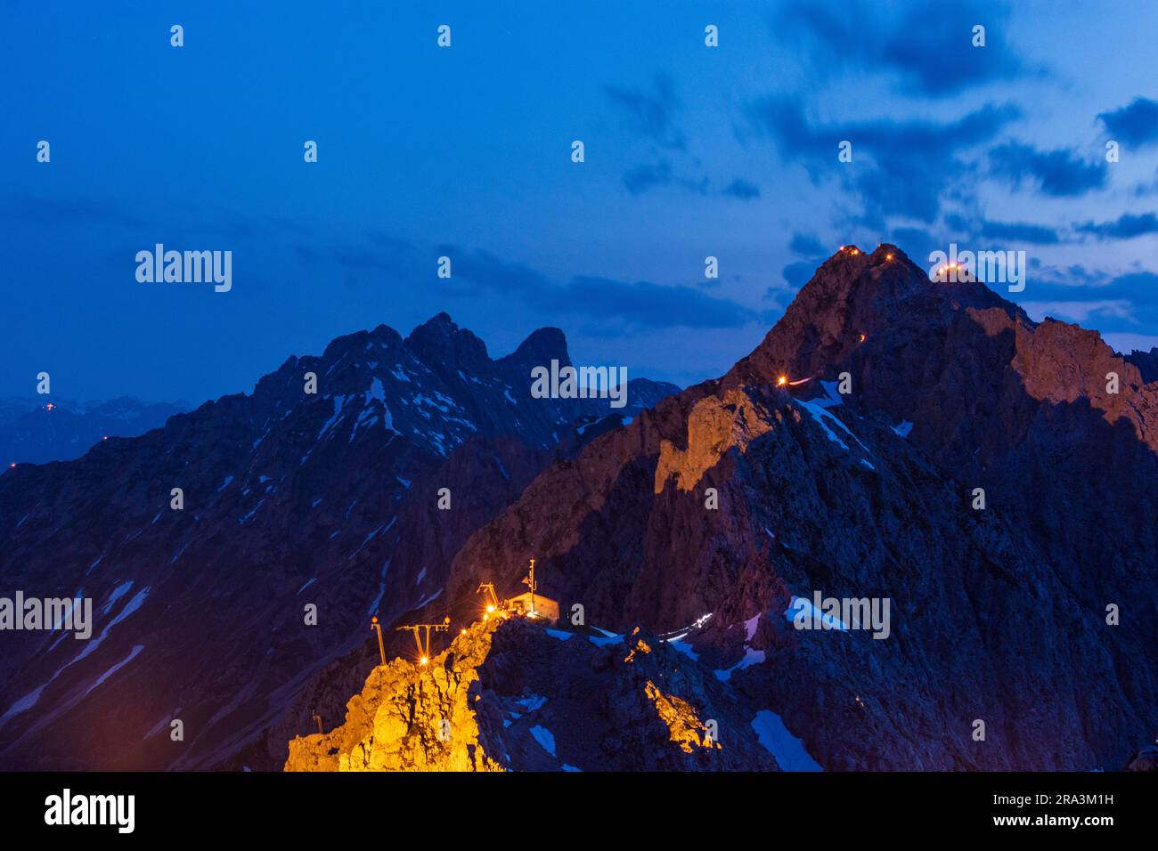 Innsbruck: solstice fire, summit Kaminspitze, mountain range Nordkette ...