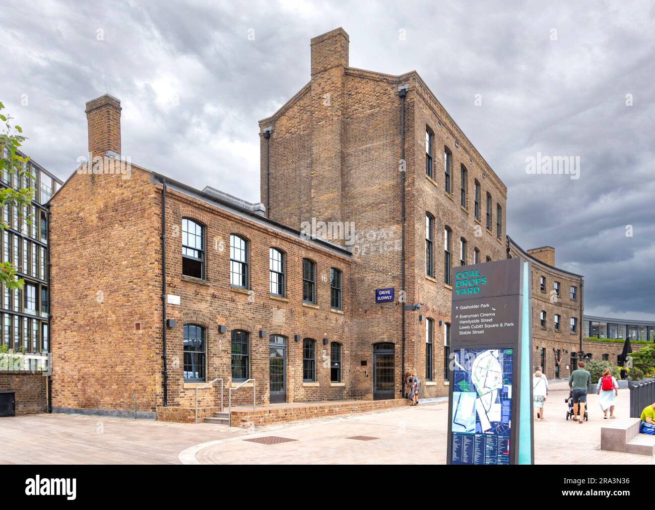 Coal Drops Yard buildings and sign at shopping complex part of Kings ...