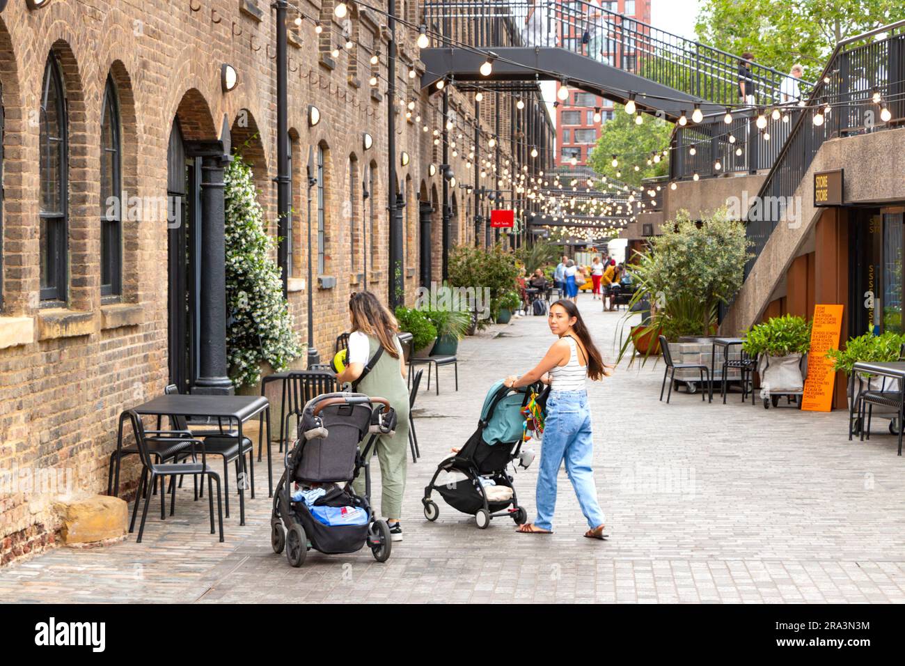 woman with strollers Coal Drops Yard shopping complex part of Kings ...
