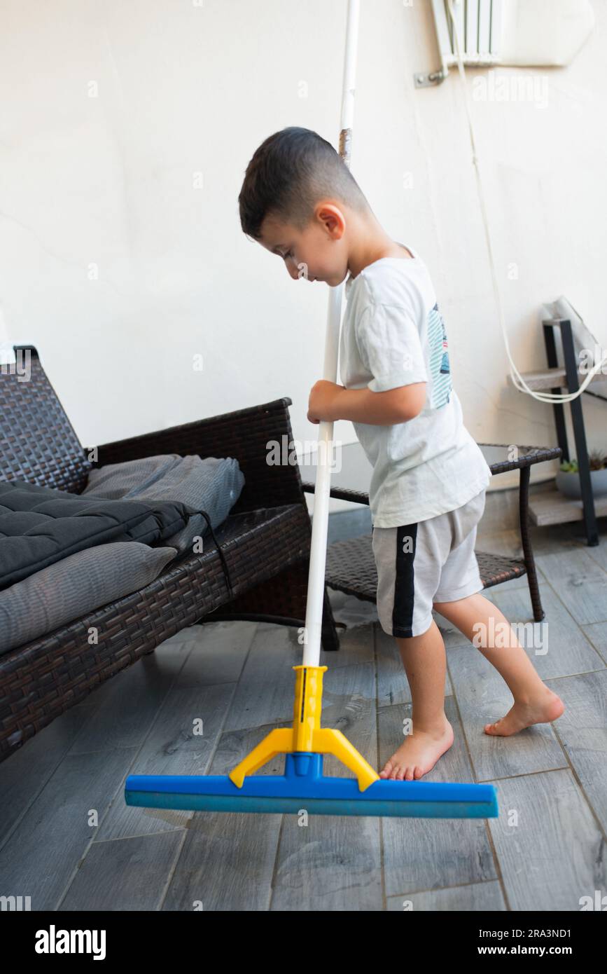 Boy girl helping house chores hi-res stock photography and images - Alamy