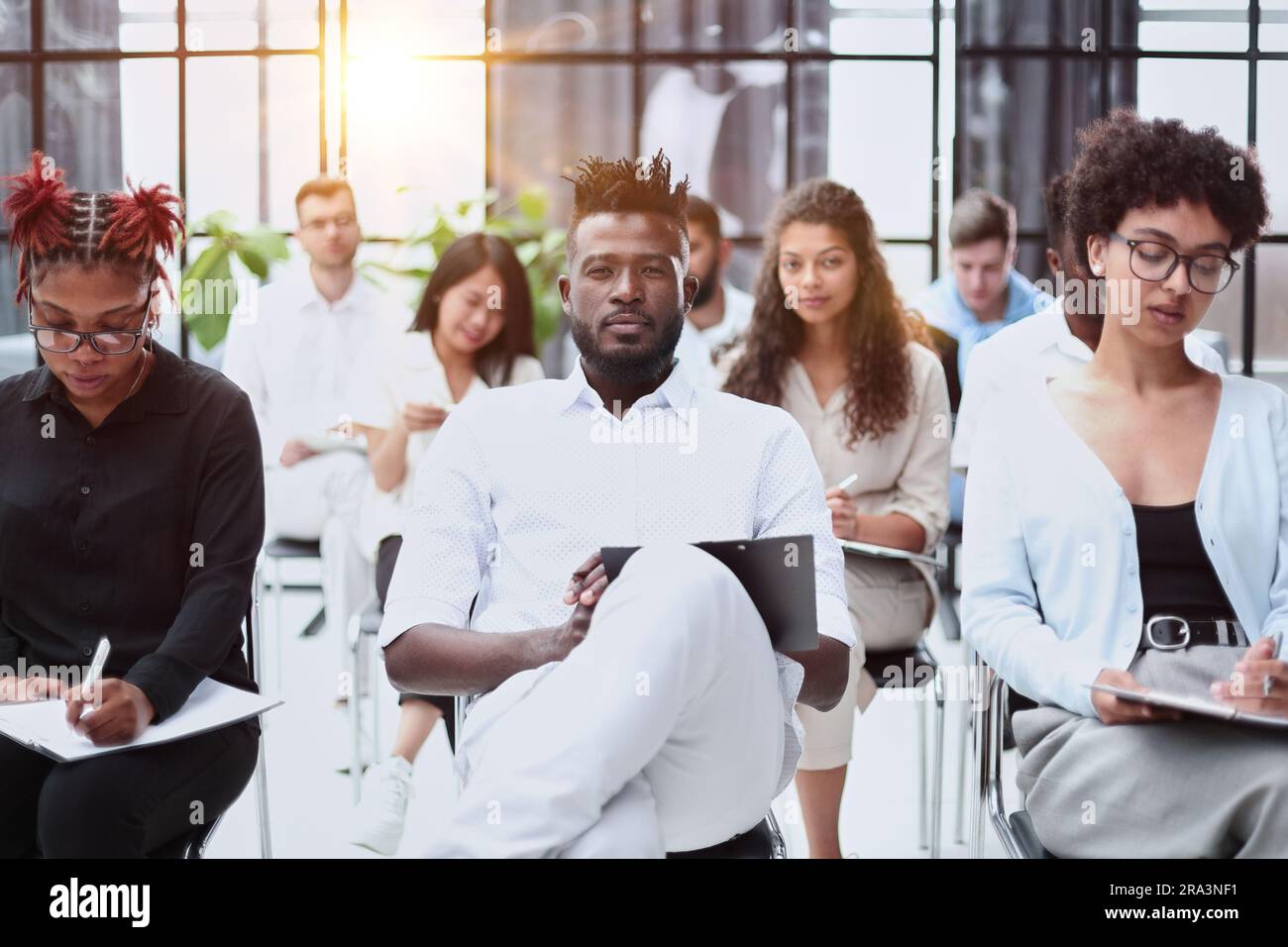 Audience attending seminar hi-res stock photography and images - Alamy