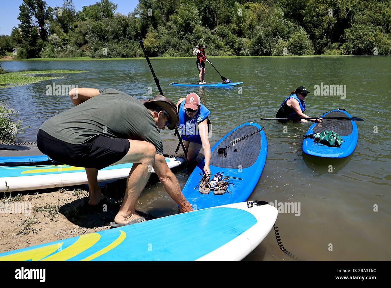 John Menth owner of Russian River Paddle Boards, guides Sahsa Browning ...
