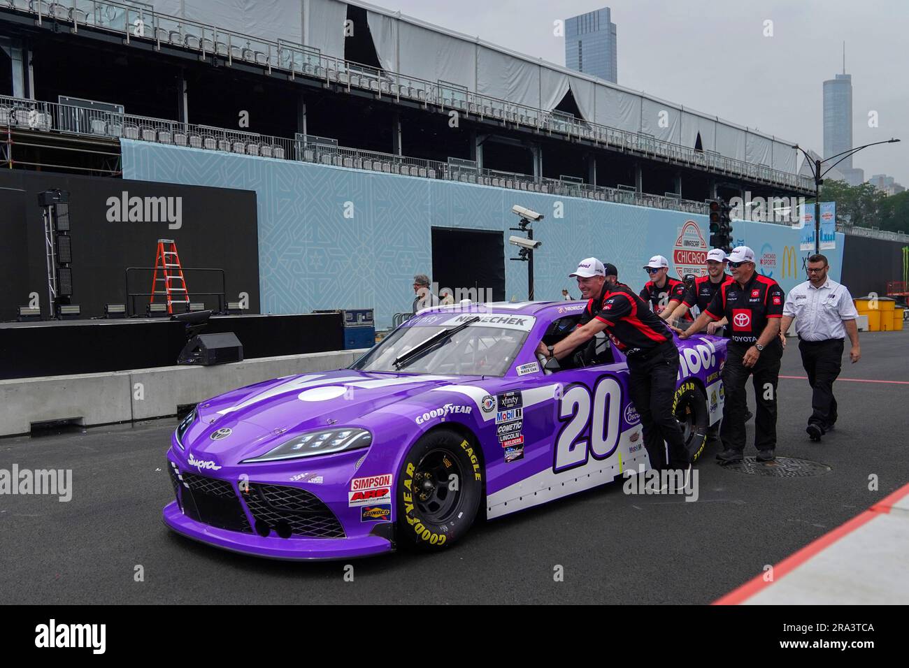 Crew members roll out the the Joe Gibbs racing Toyota, to be driven by ...