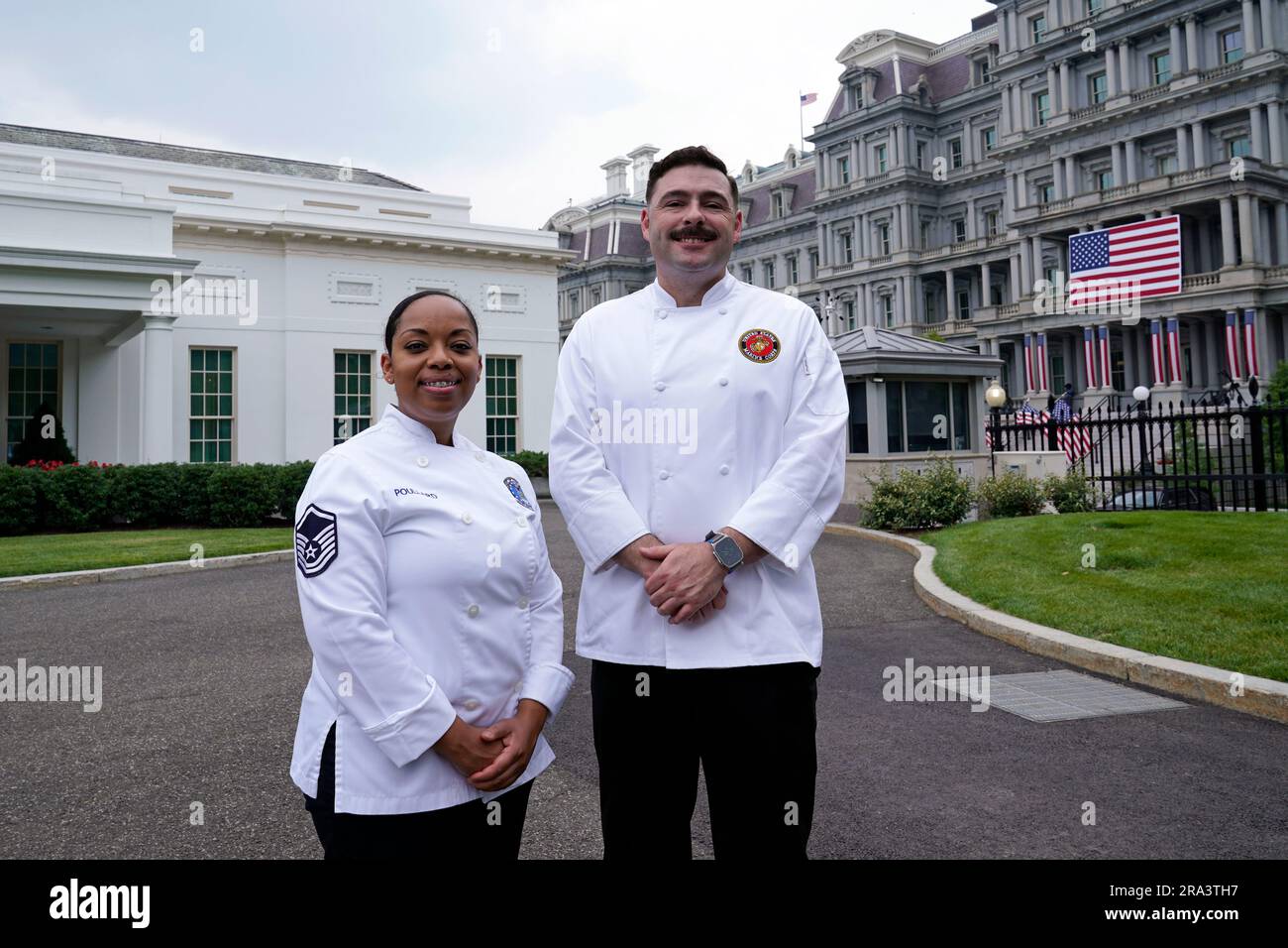 Air Force Master Sgt. and chef Opal Poullard, left, and Marine Corps Gunnery Sgt. and chef ...