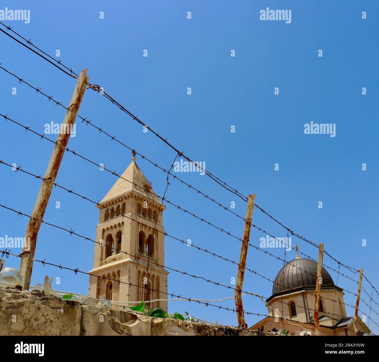 church steeple behind barbed wire fence Jerusalem Stock Photo - Alamy