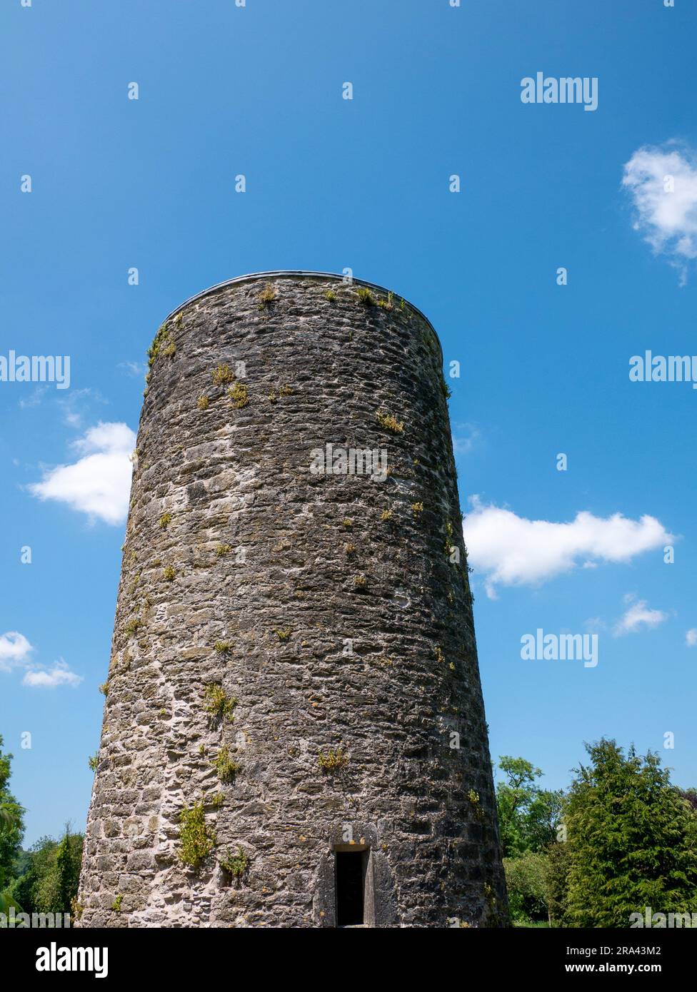 Old celtic castle tower over blue sky background, Blarney castle in ...