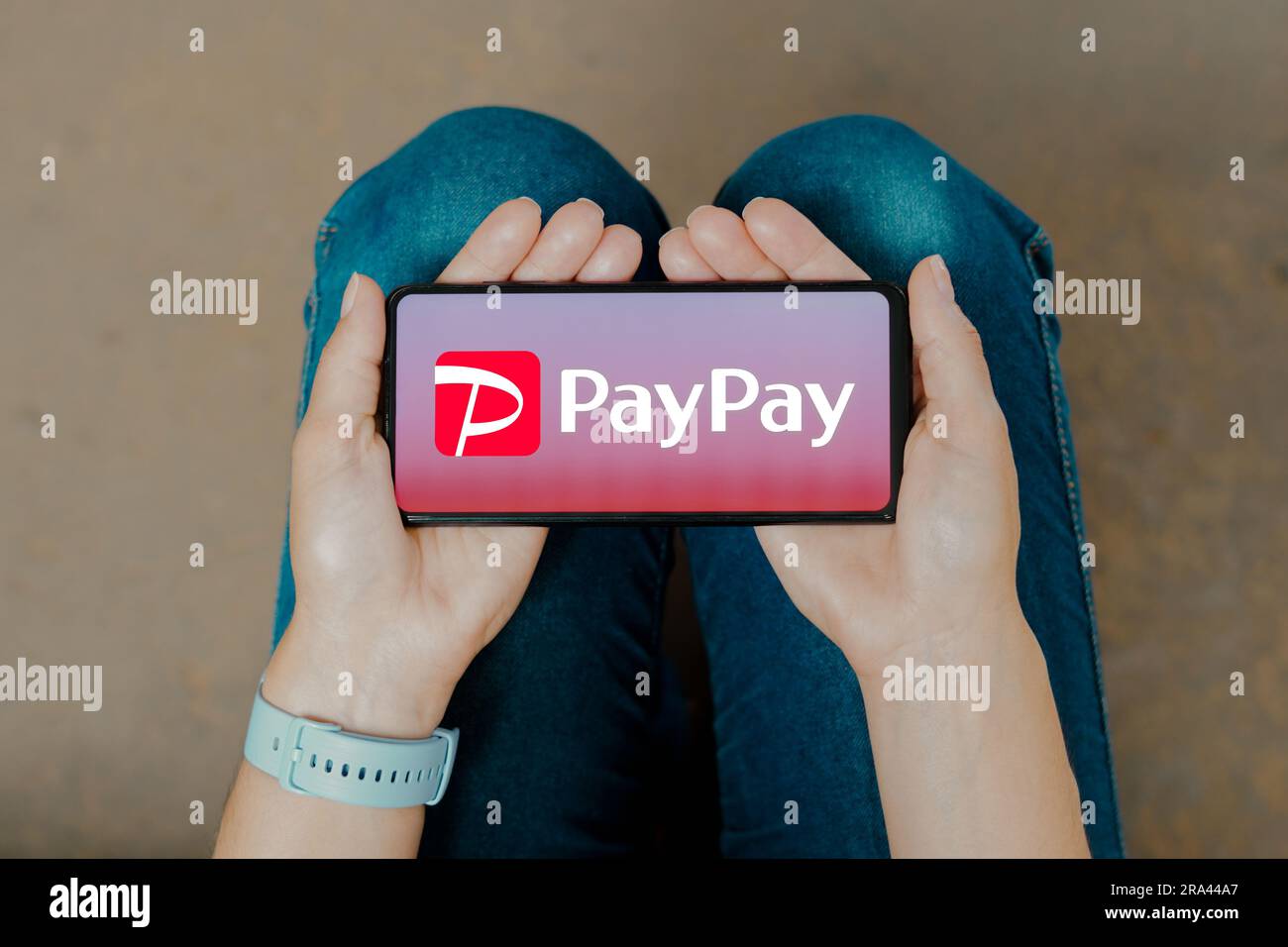 In this photo illustration, the PayPay Corporation logo is displayed on a smartphone screen ...