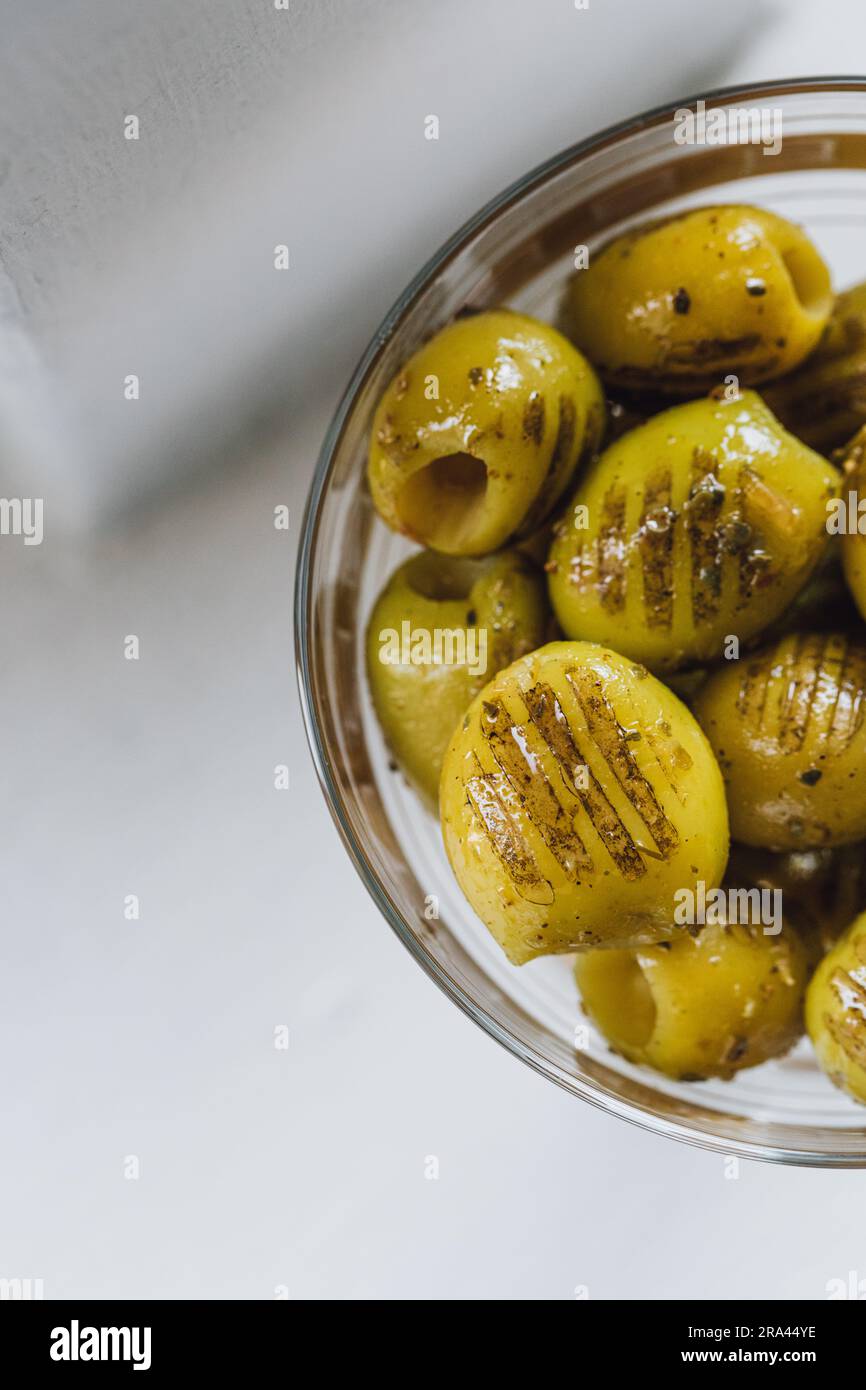 green grilled greek olives Stock Photo - Alamy