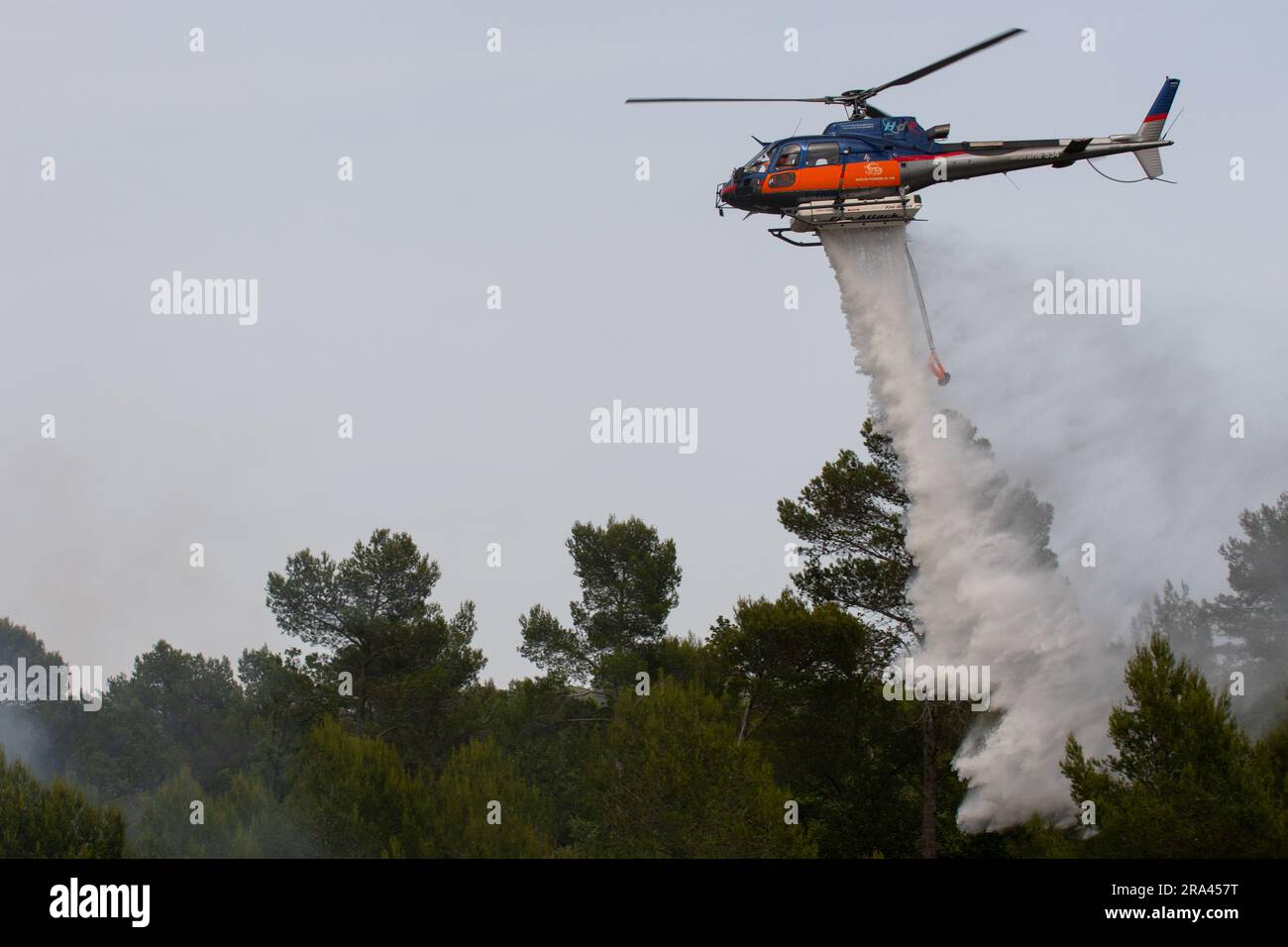 A water bomber helicopter responds to a forest fire. The Var ...