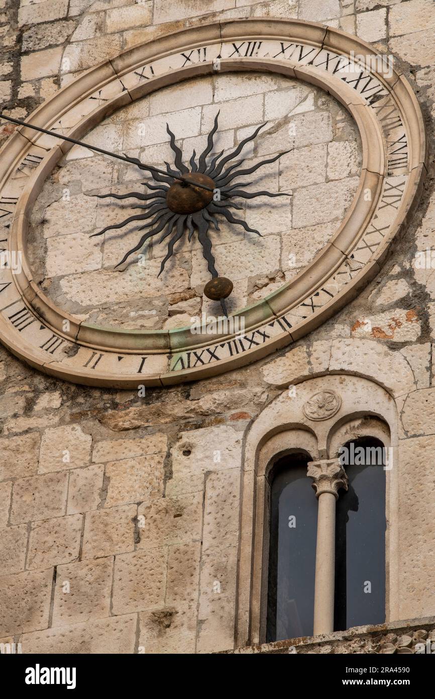 decorative stone antique clockface on a building in grad split, croatia ...
