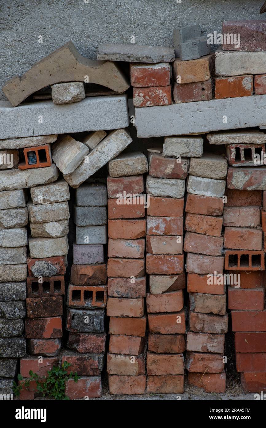 pile of reclaimed red bricks ready for use in restoration project ...