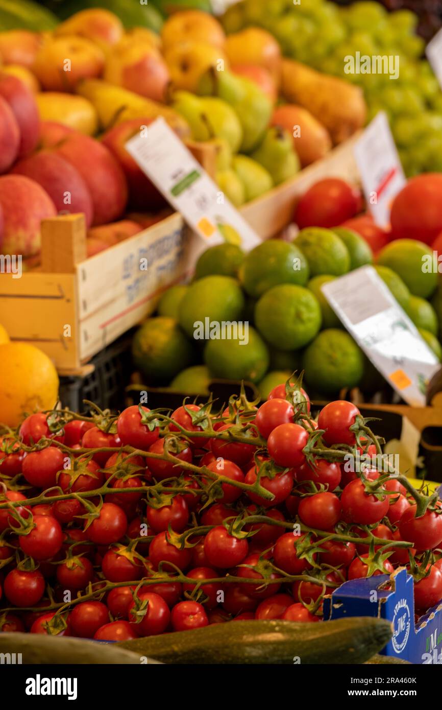 brightly coloured fresh fruits and vegetables on display at a farmers market in trogir, grad ...