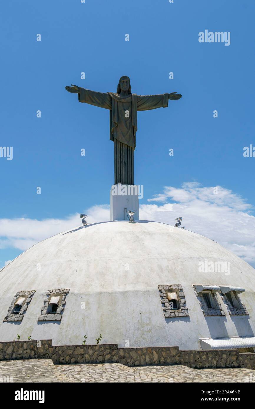 Statue of Christ atop a domed building on Mount Isabel de Torres. In ...