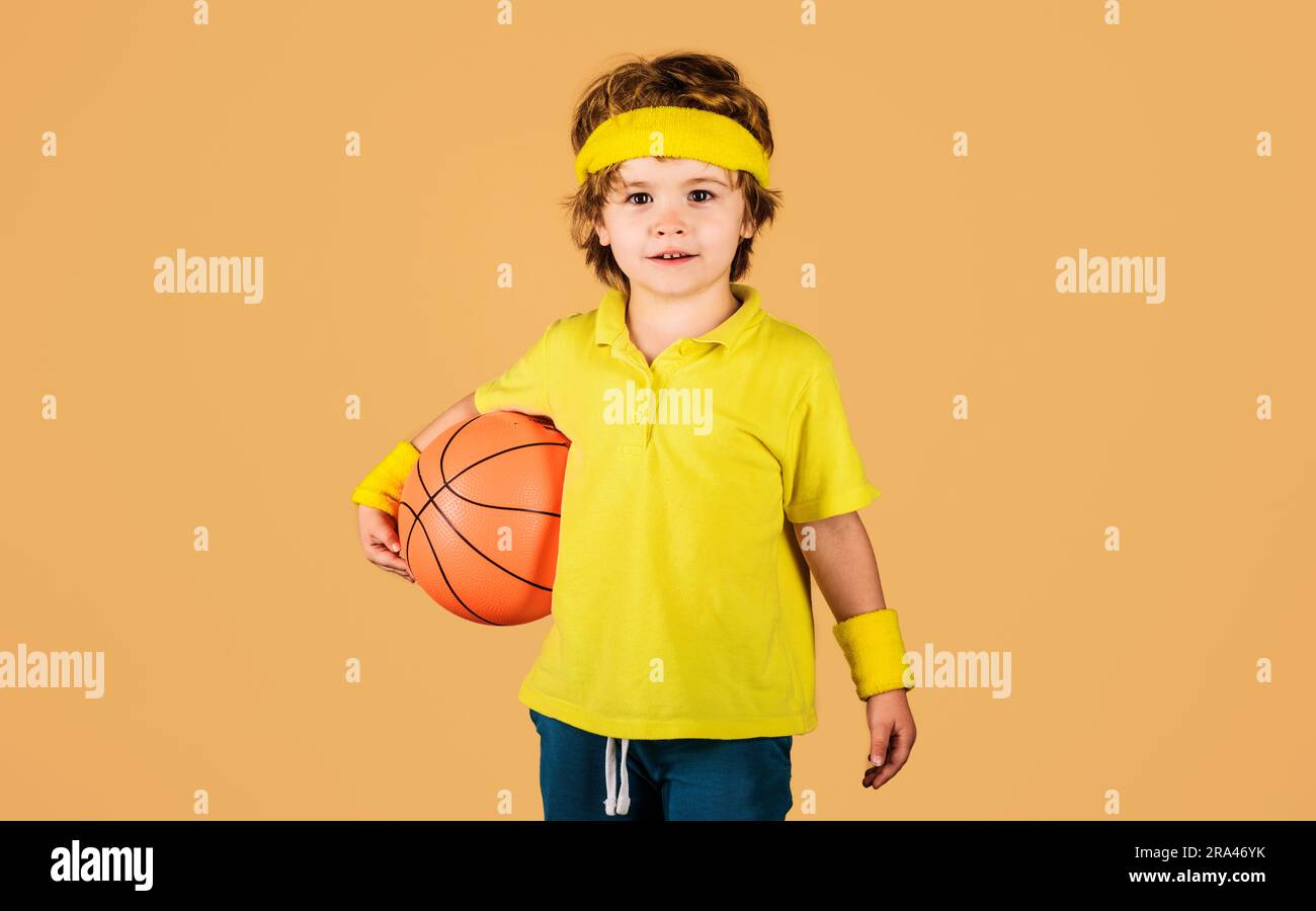 Sport activity. Little basketball player with basketball ball. Sporty ...