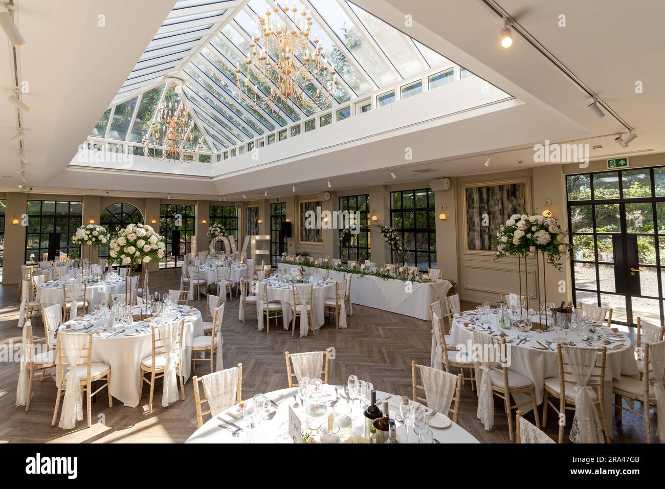 An empty wedding reception area set up with tables, ready for guests to ...