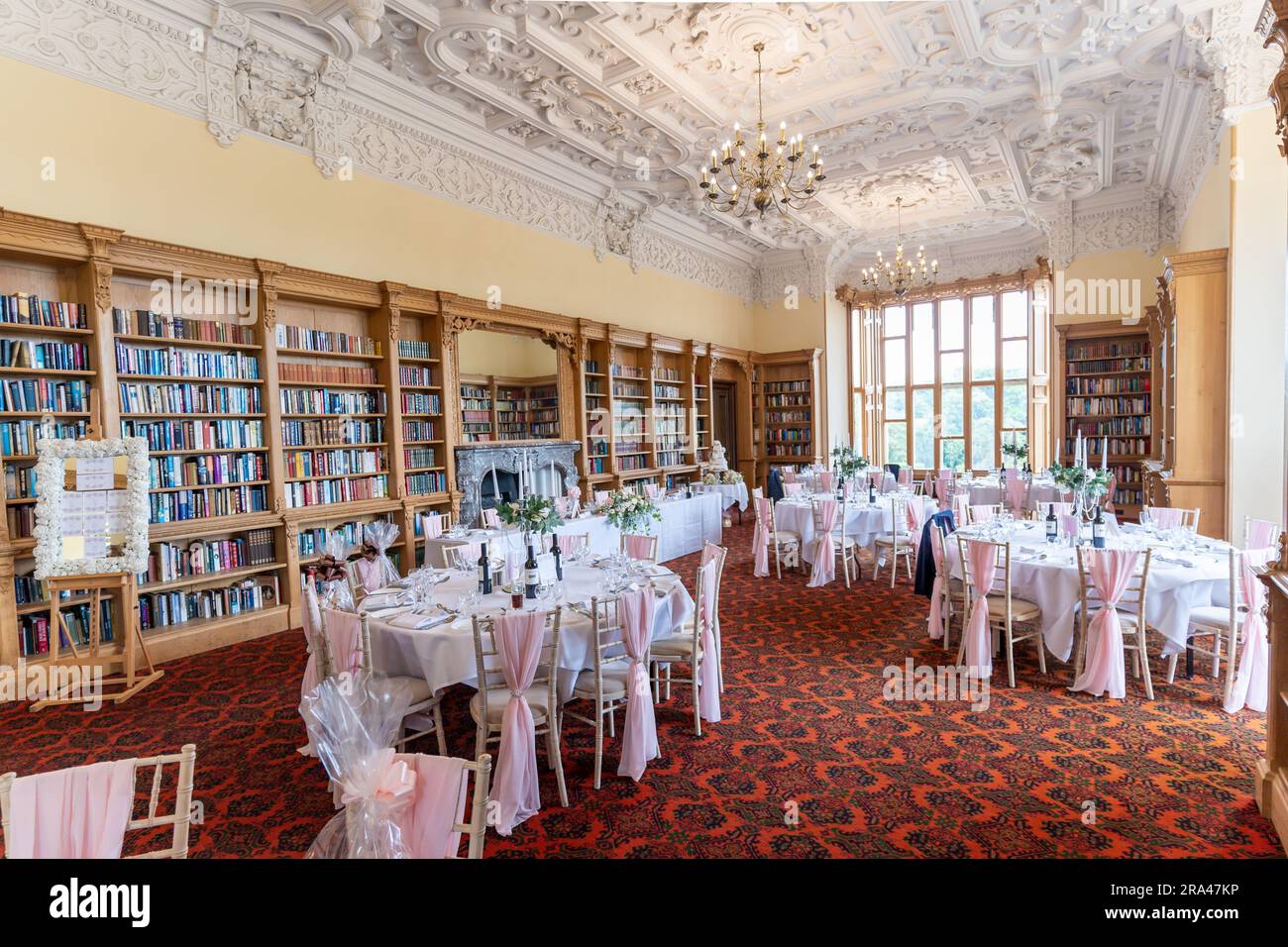 An empty wedding reception area set up with tables, ready for guests to ...