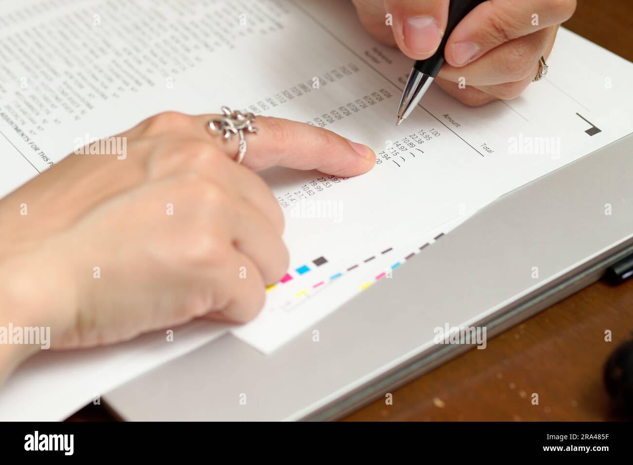 young woman writing on a bill of purchase Stock Photo - Alamy
