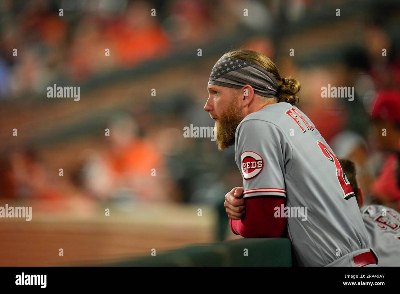 Cincinnati Reds right fielder Jake Fraley sits in the dugout in the ...