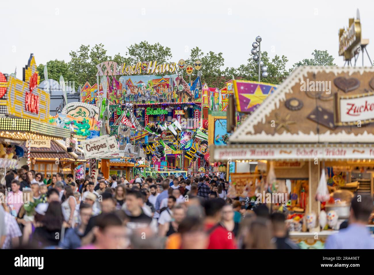 30 June 2023, Bavaria, Würzburg: People visit the Kiliani Folk Festival ...