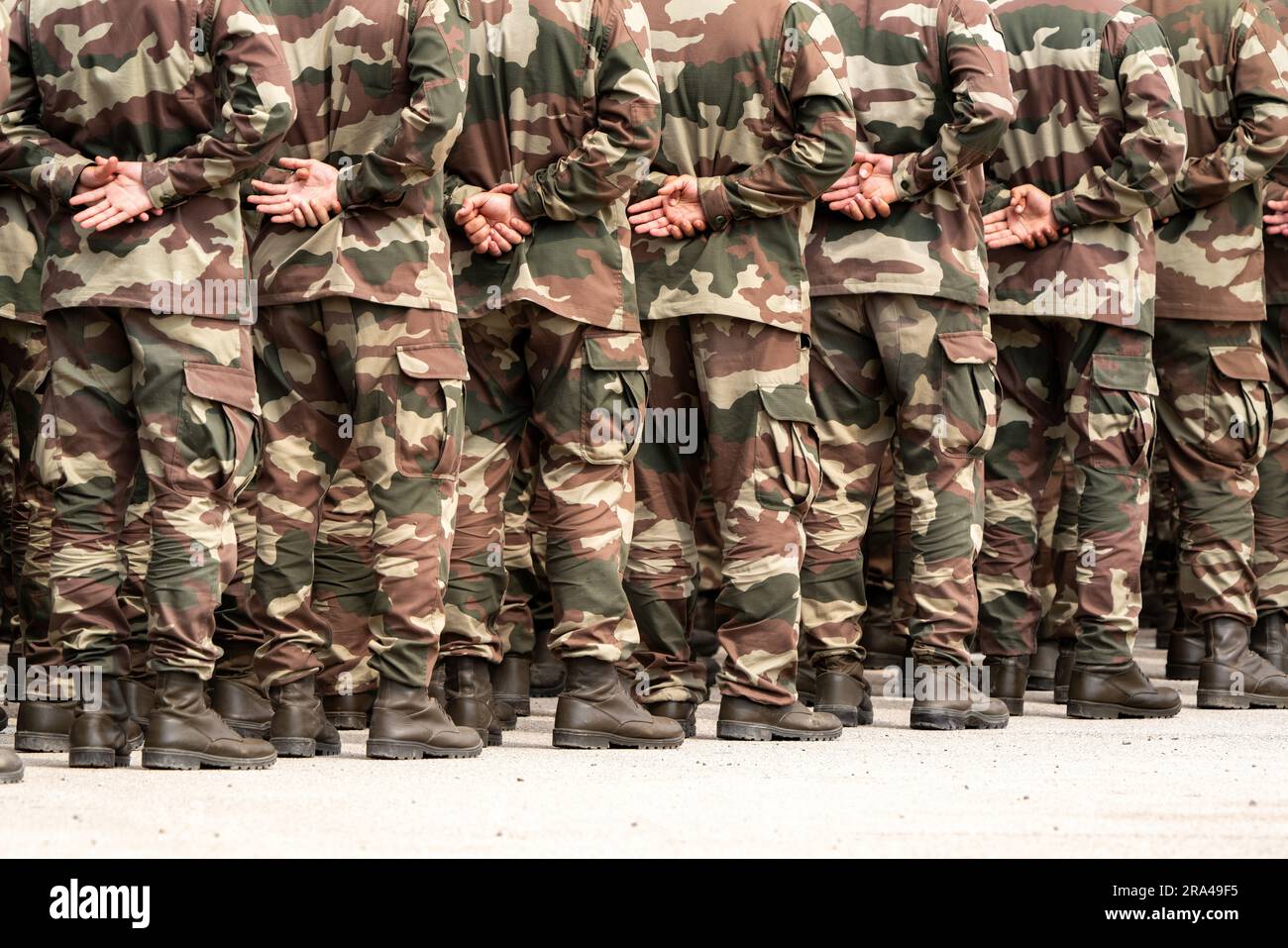 Soldiers in a relaxed position during the ceremony. Military unit ...