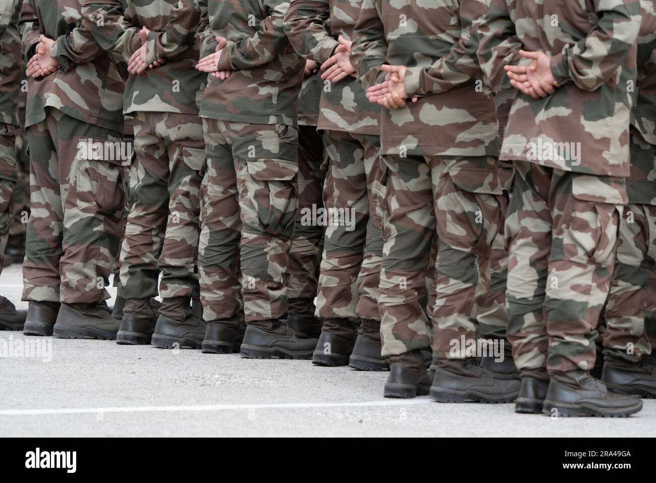 Soldiers in a relaxed position during the ceremony. Military unit ...