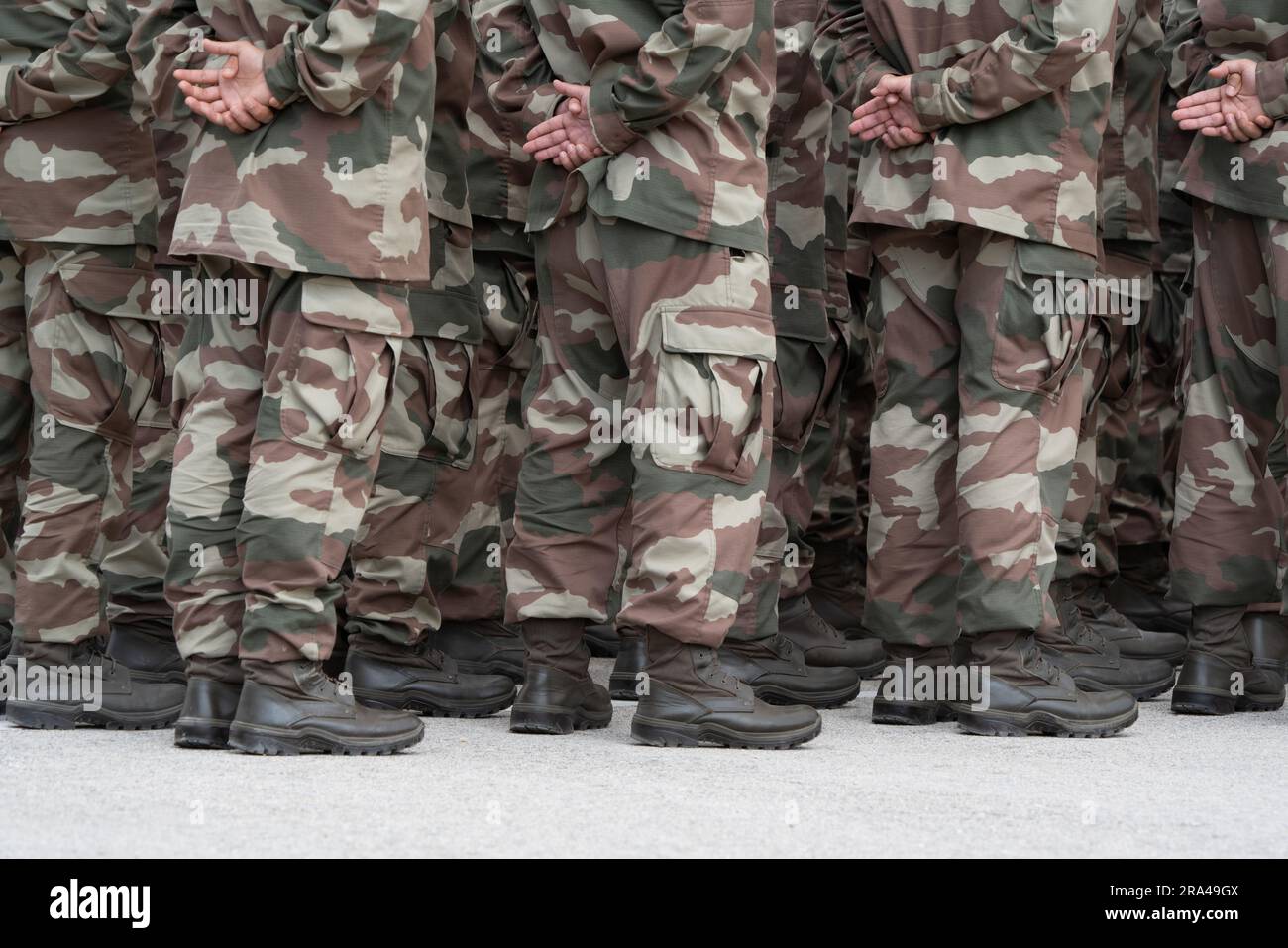 Soldiers in a relaxed position during the ceremony. Military unit ...