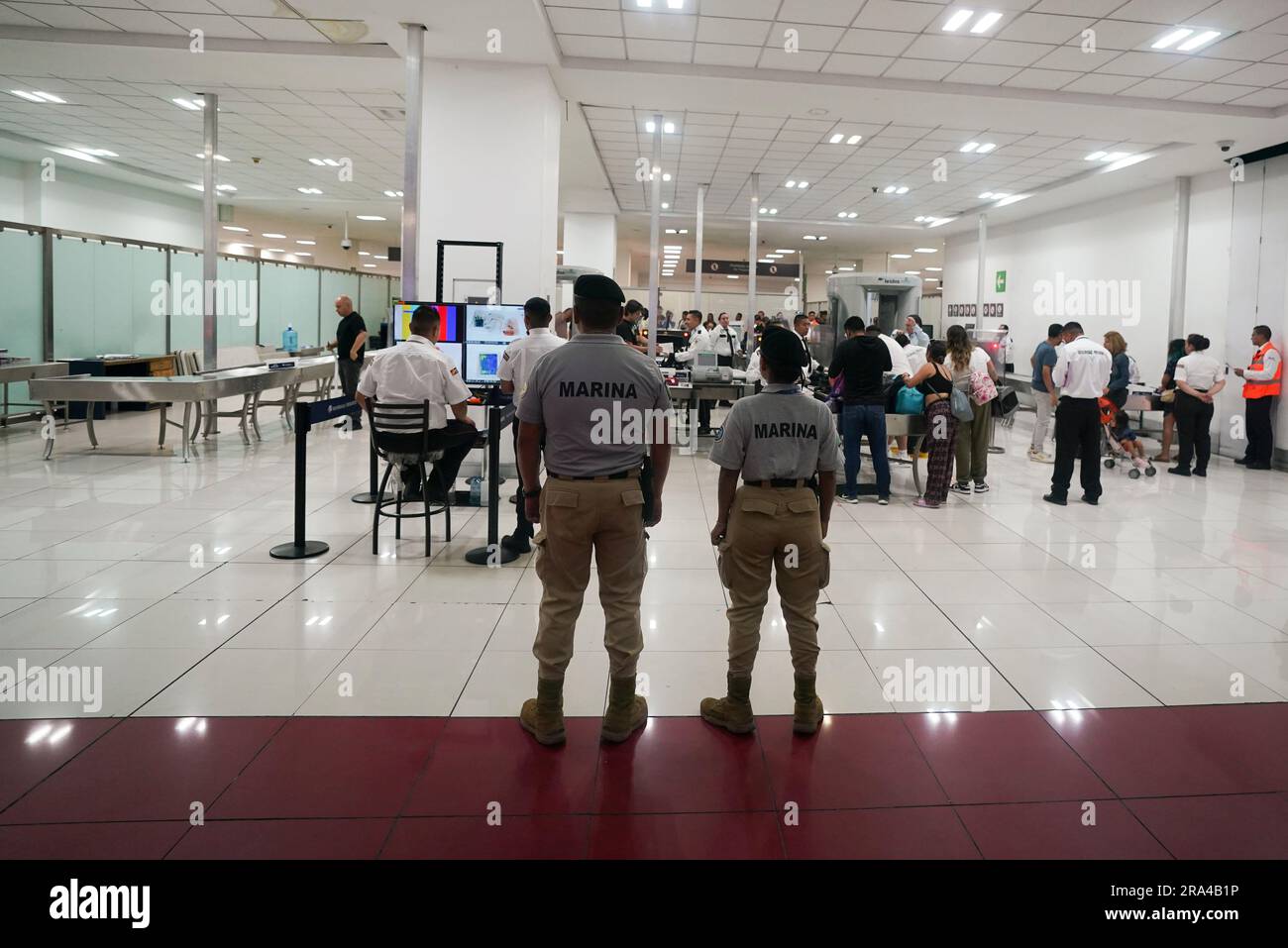 Mexican Navy officers stand guard next to a security checkpoint at the ...