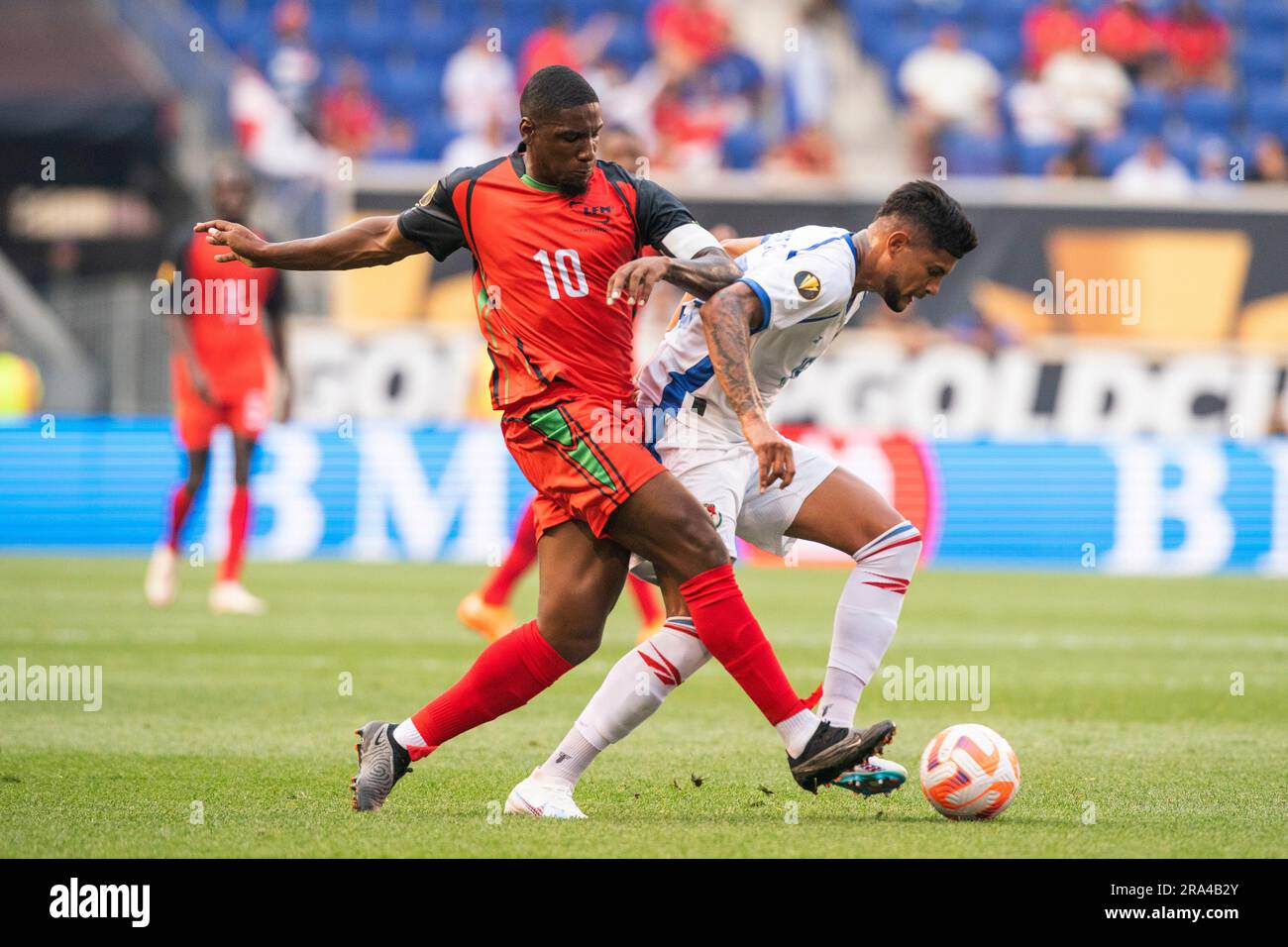 Panama defender Andres Andrade, right, vies for the ball against Martinique forward Brighton ...