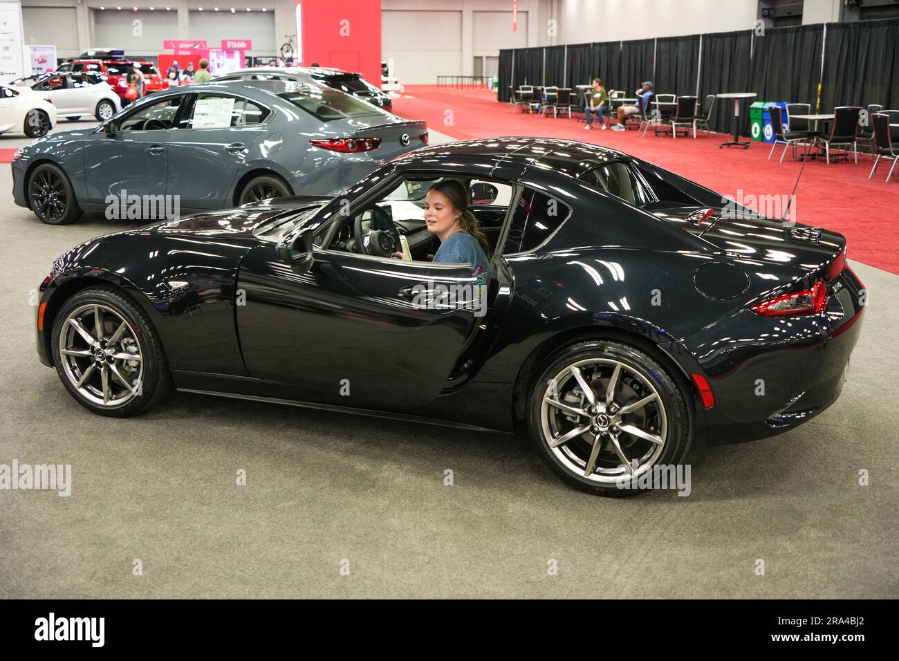 Austin, USA. 30th June, 2023. A visitor checks out a 2-seater car at ...