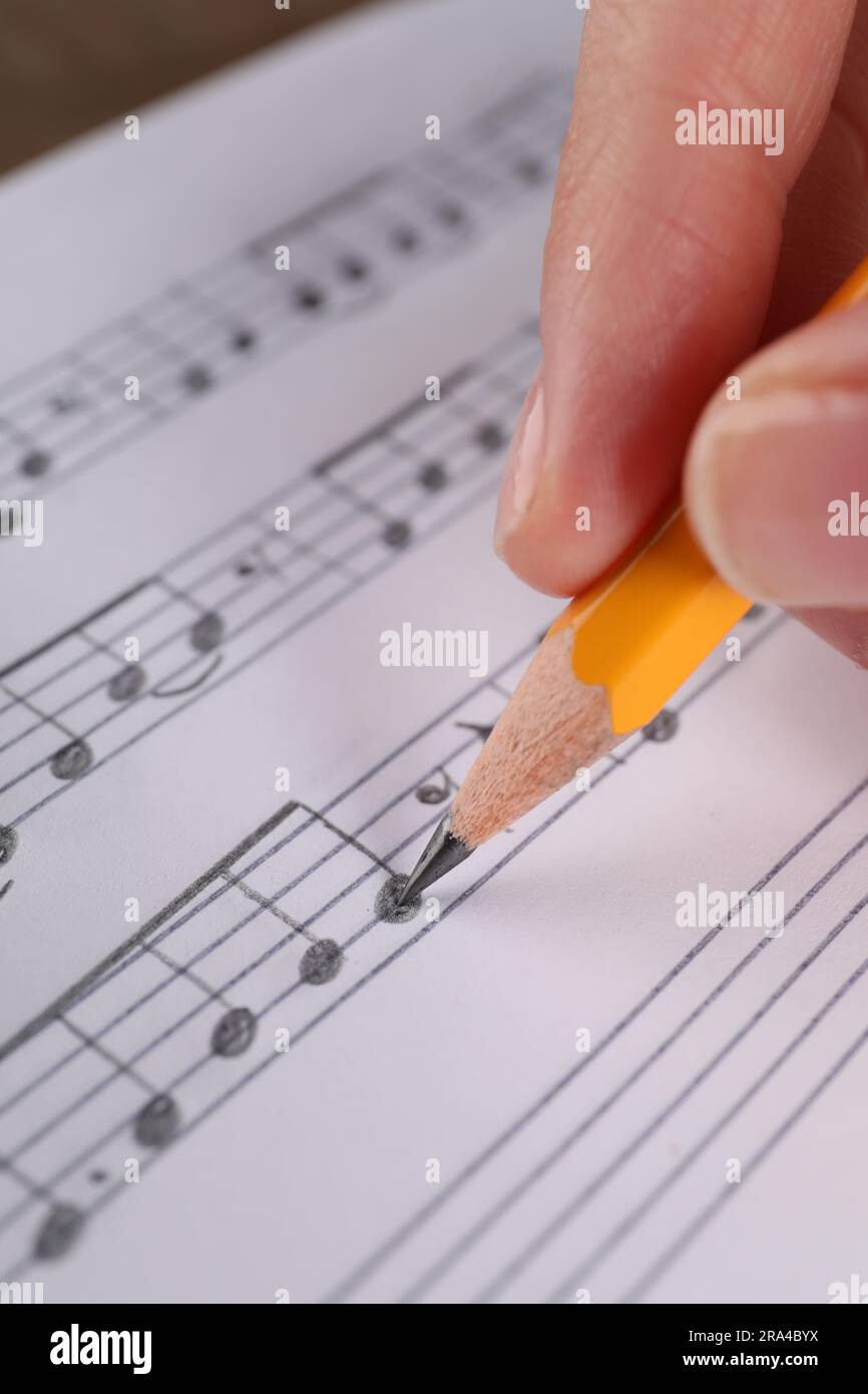 Woman writing musical notes hi-res stock photography and images - Alamy