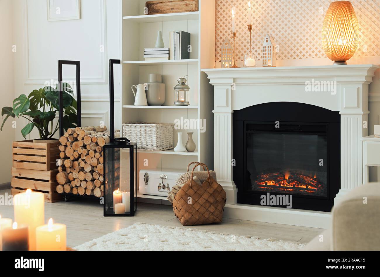 Stylish living room with beautiful fireplace and different decor ...