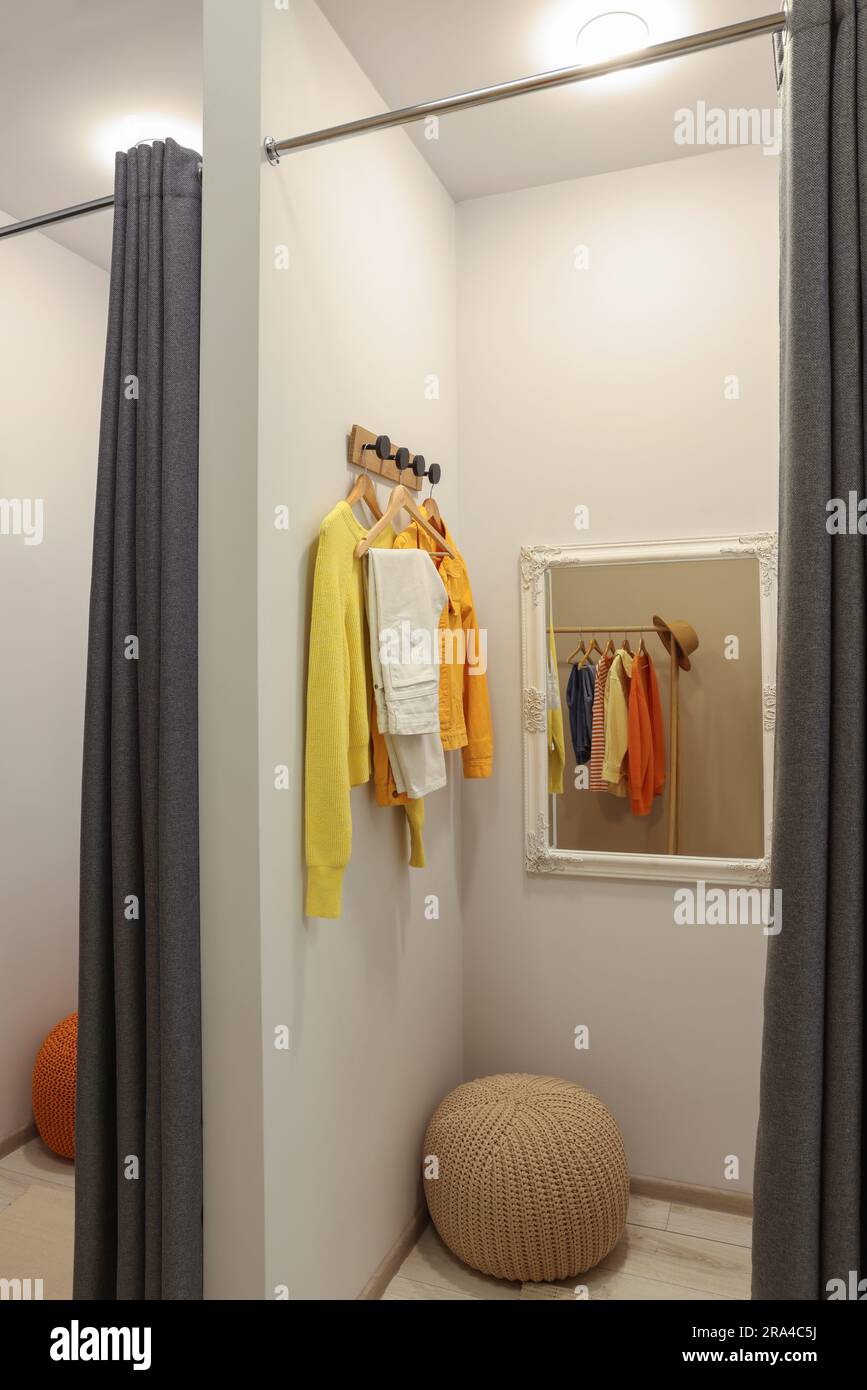 Dressing room with mirror in fashion store. Stylish design Stock Photo ...