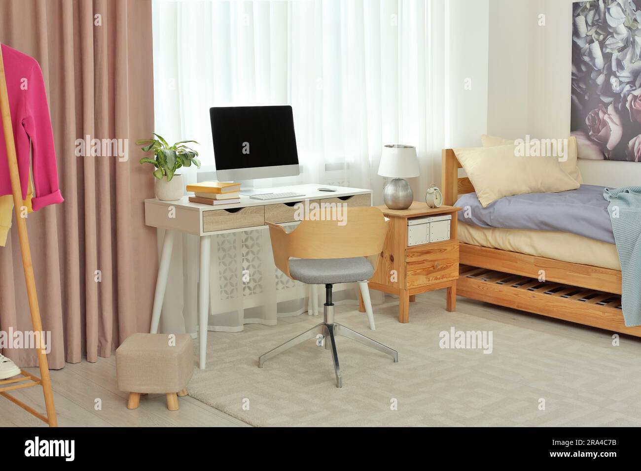 Stylish teenager's room interior with computer and comfortable bed ...