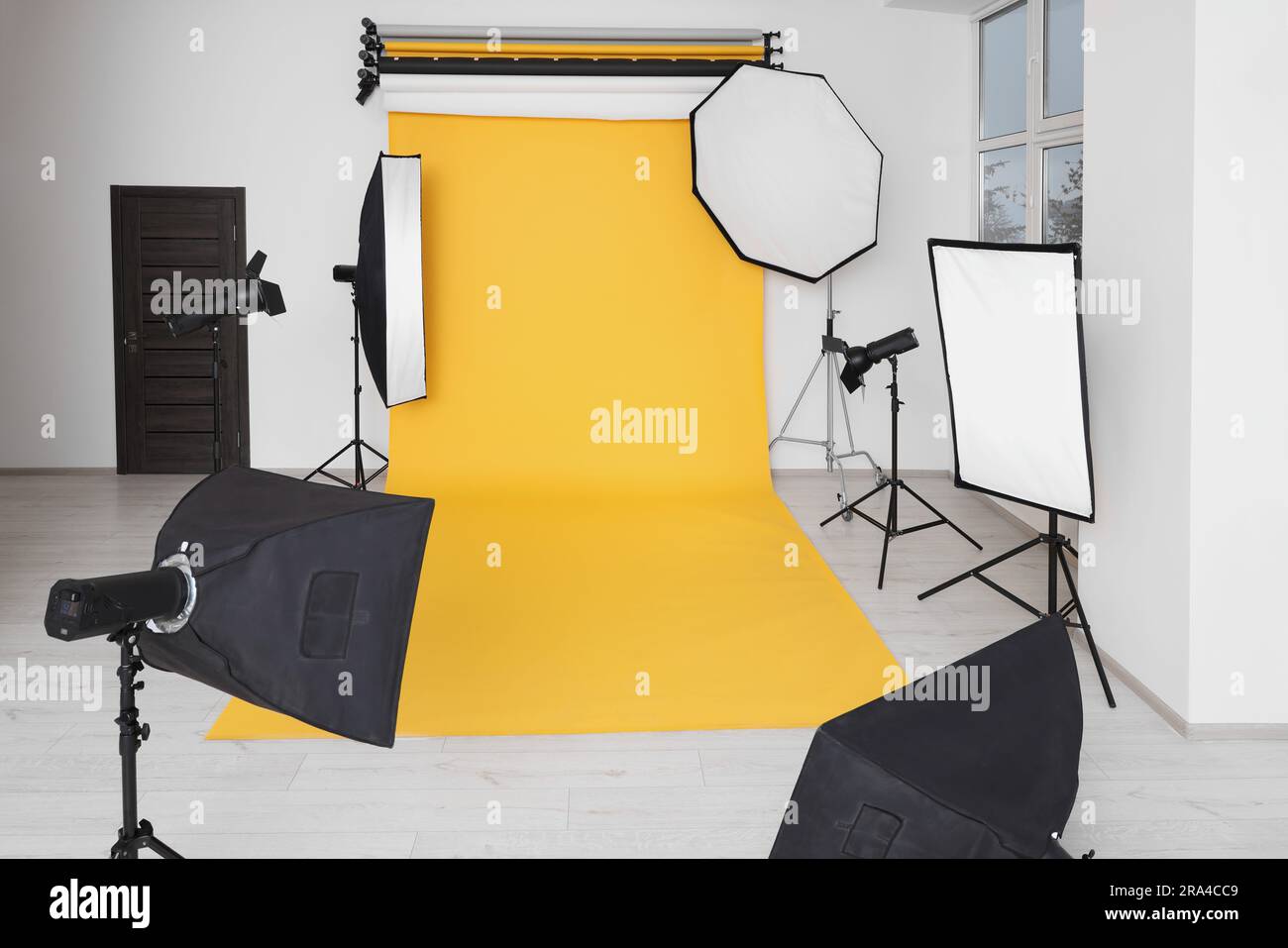 Interior of modern photo studio with professional lighting equipment ...