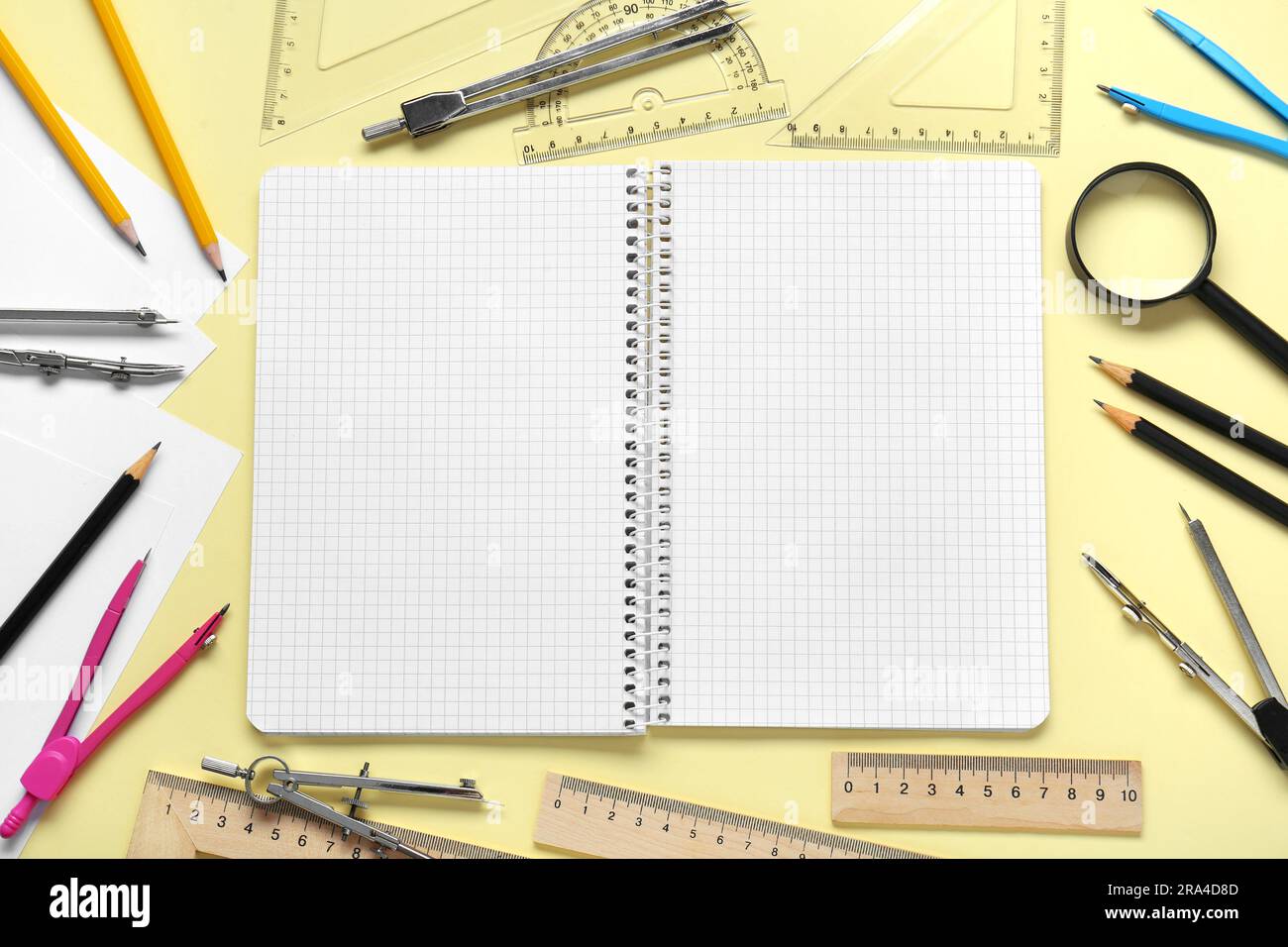 Flat lay composition with different rulers and compasses on yellow ...