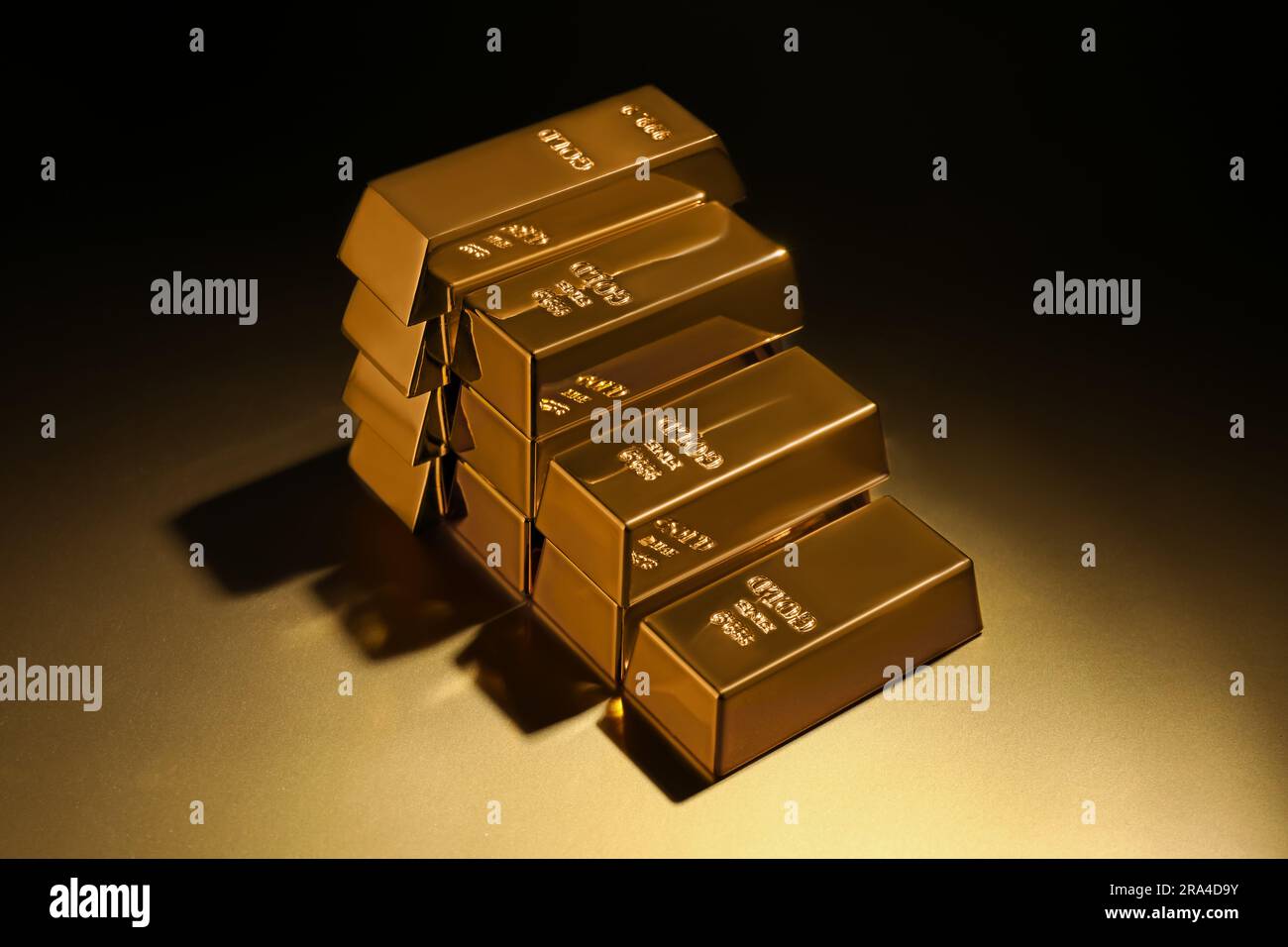 Stack of shiny gold bars on color background Stock Photo - Alamy