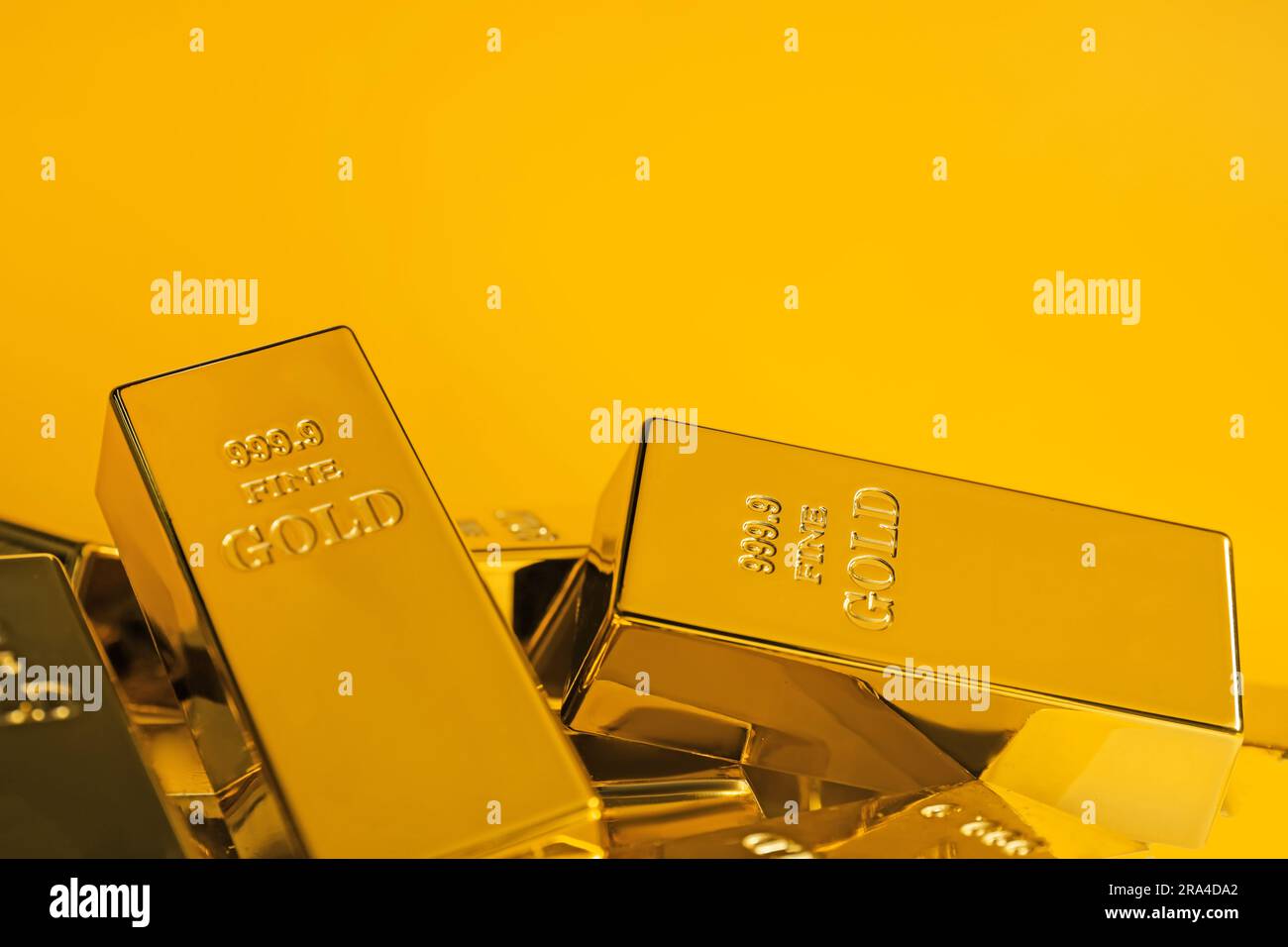 Many shiny gold bars on orange background, closeup. Space for text Stock Photo - Alamy