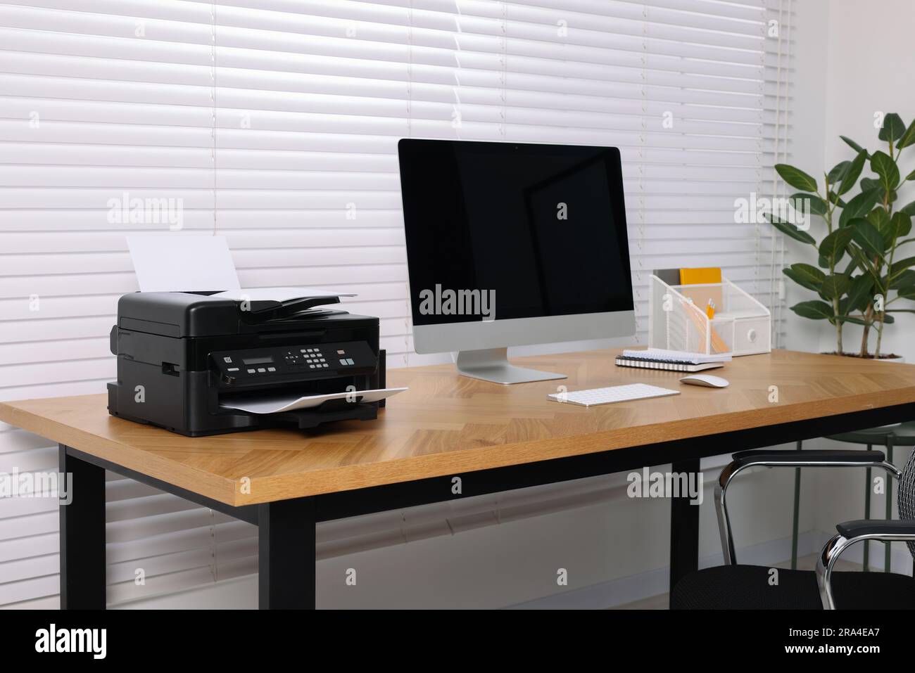 Stylish room interior with desk, modern printer and computer Stock ...