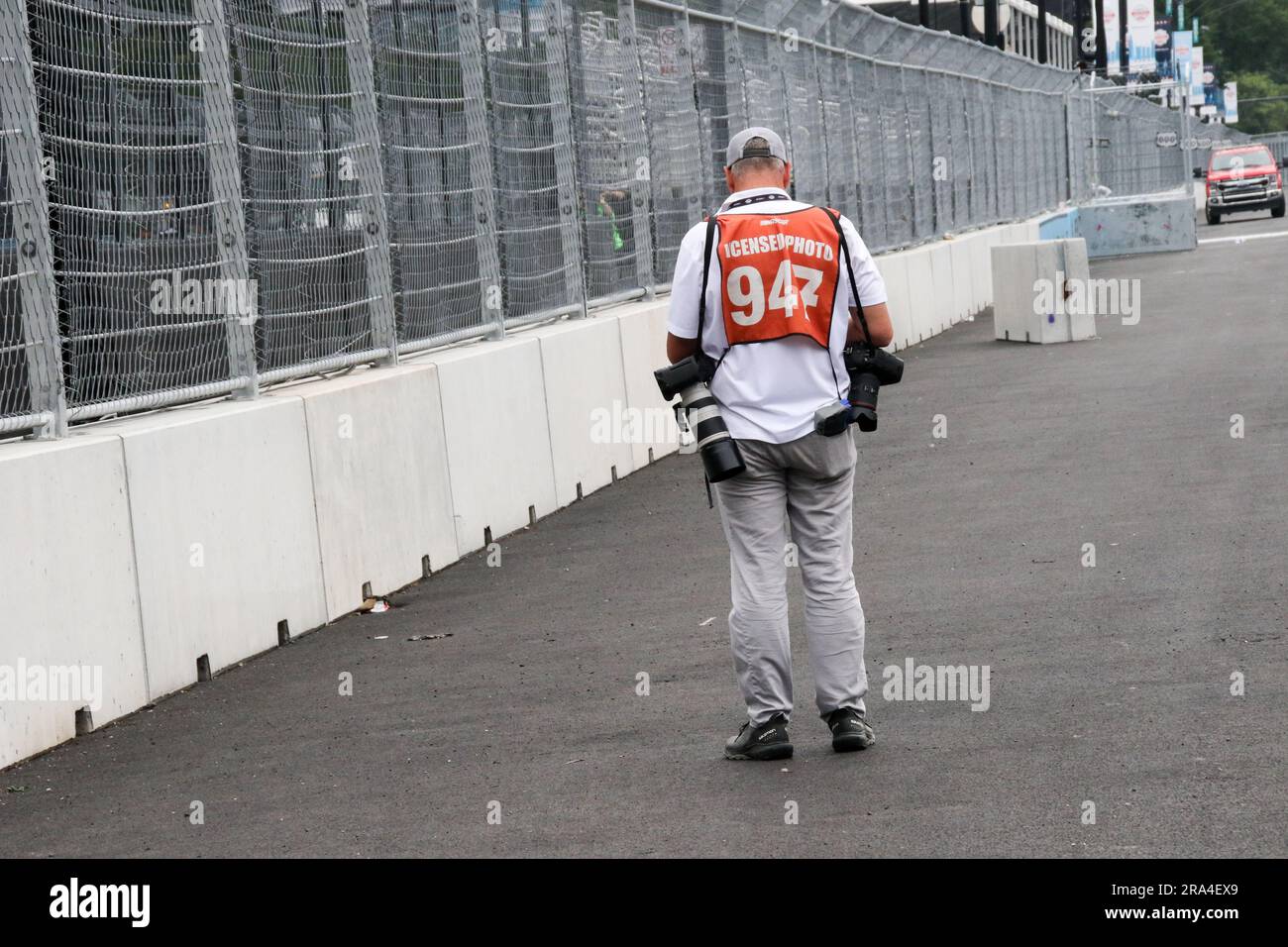 Media photographers wear the mandatory NASCAR photo vests on a portion ...