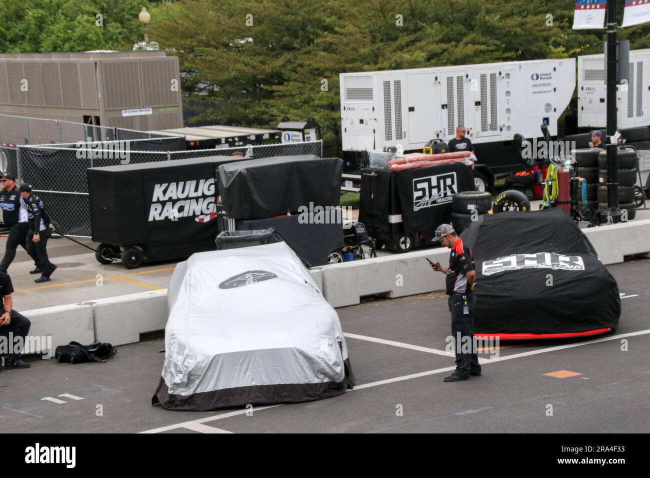 Pit crew workers prepare the cars for the inaugural NASCAR Chicago ...