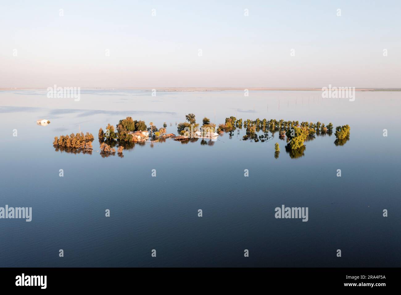 A flooded ranch house near Corcoran, California. Tulare Lake was once ...
