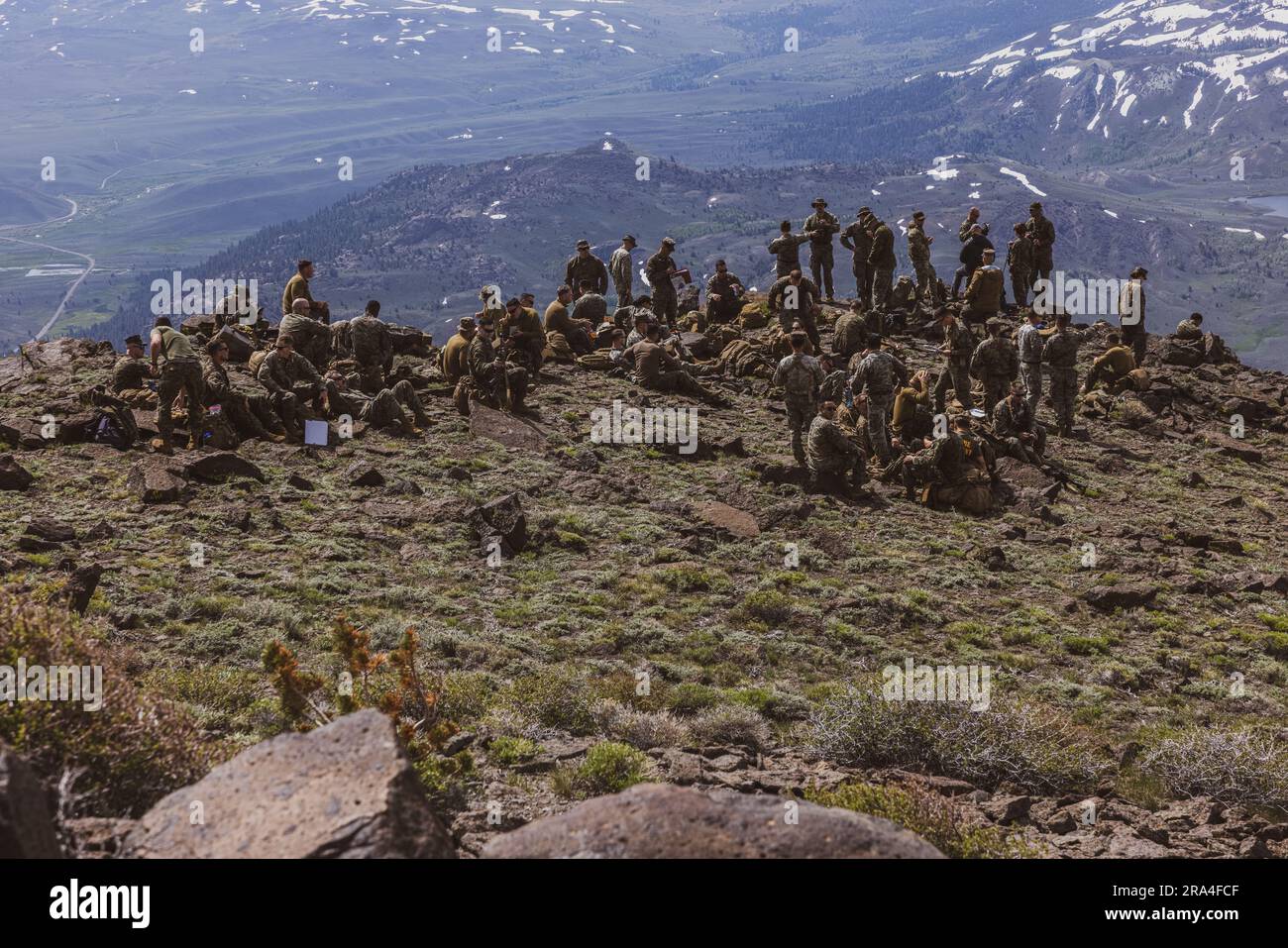 U.S. Marines with 4th Marine Division hike to Mean Peak to conduct a ...