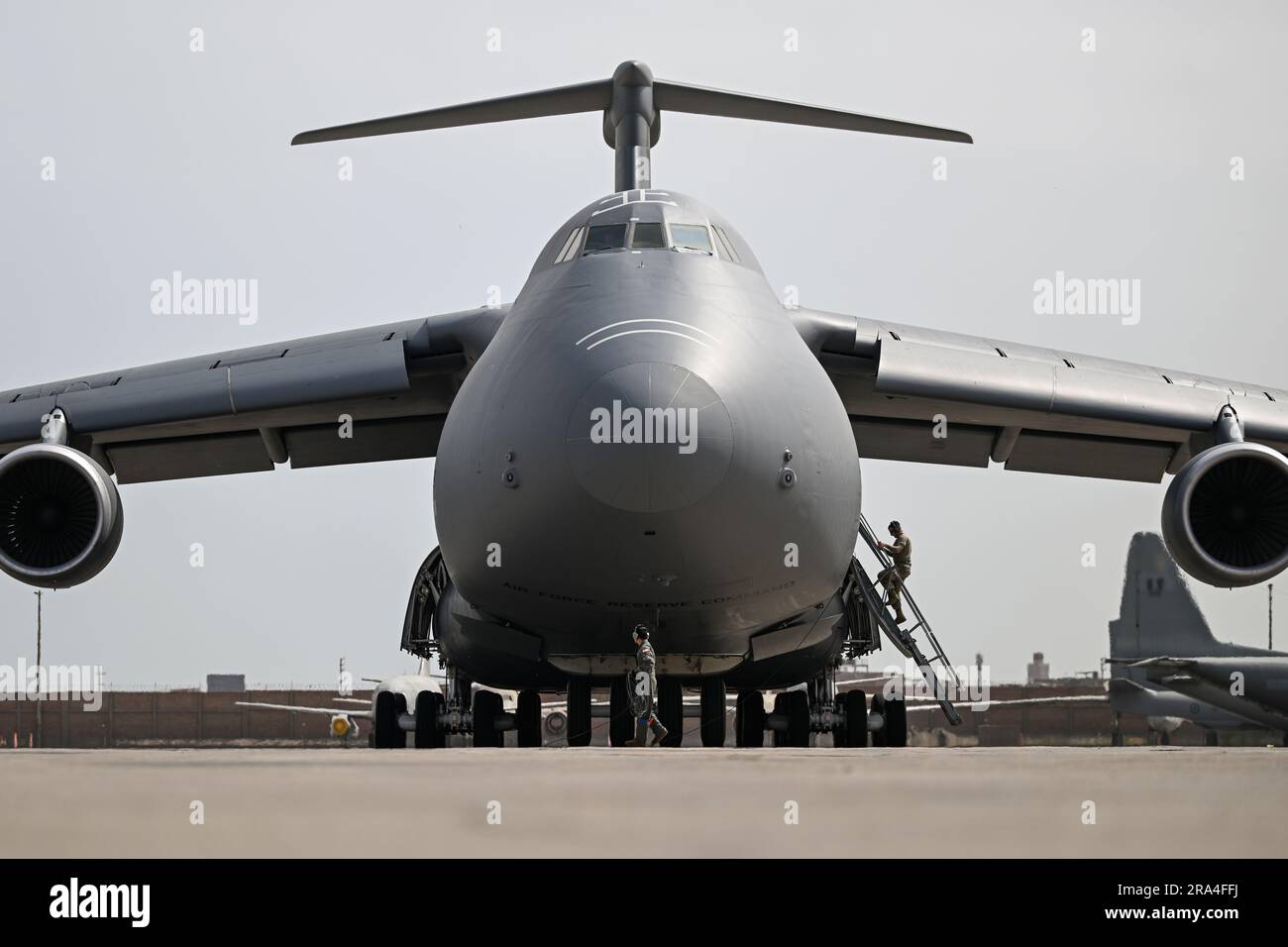 U.S. Airmen prepare a C-5M Super Galaxy cargo aircraft, assigned to the ...