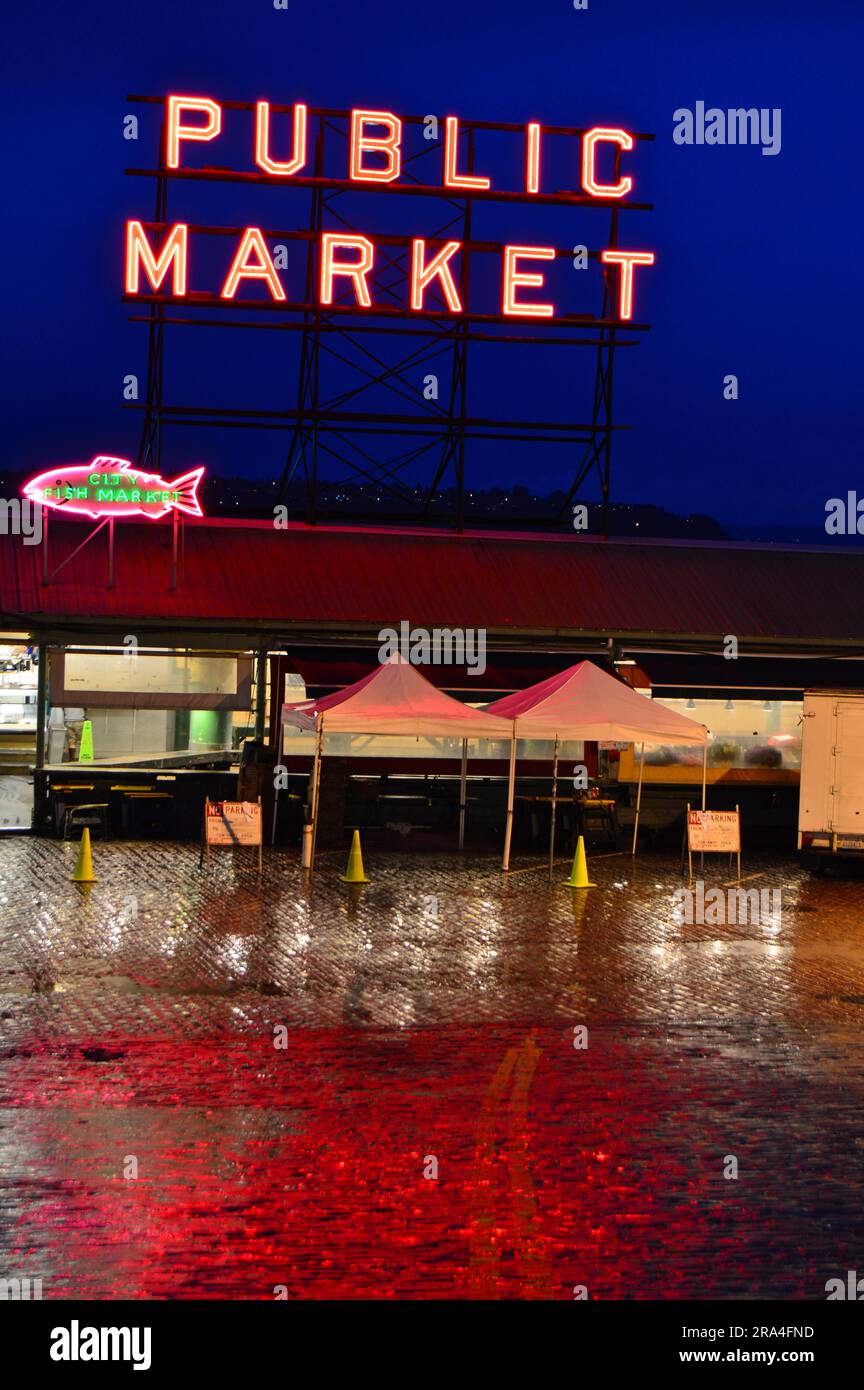 The neon lights of the Public fish Market at Pike Place in Seattle are ...