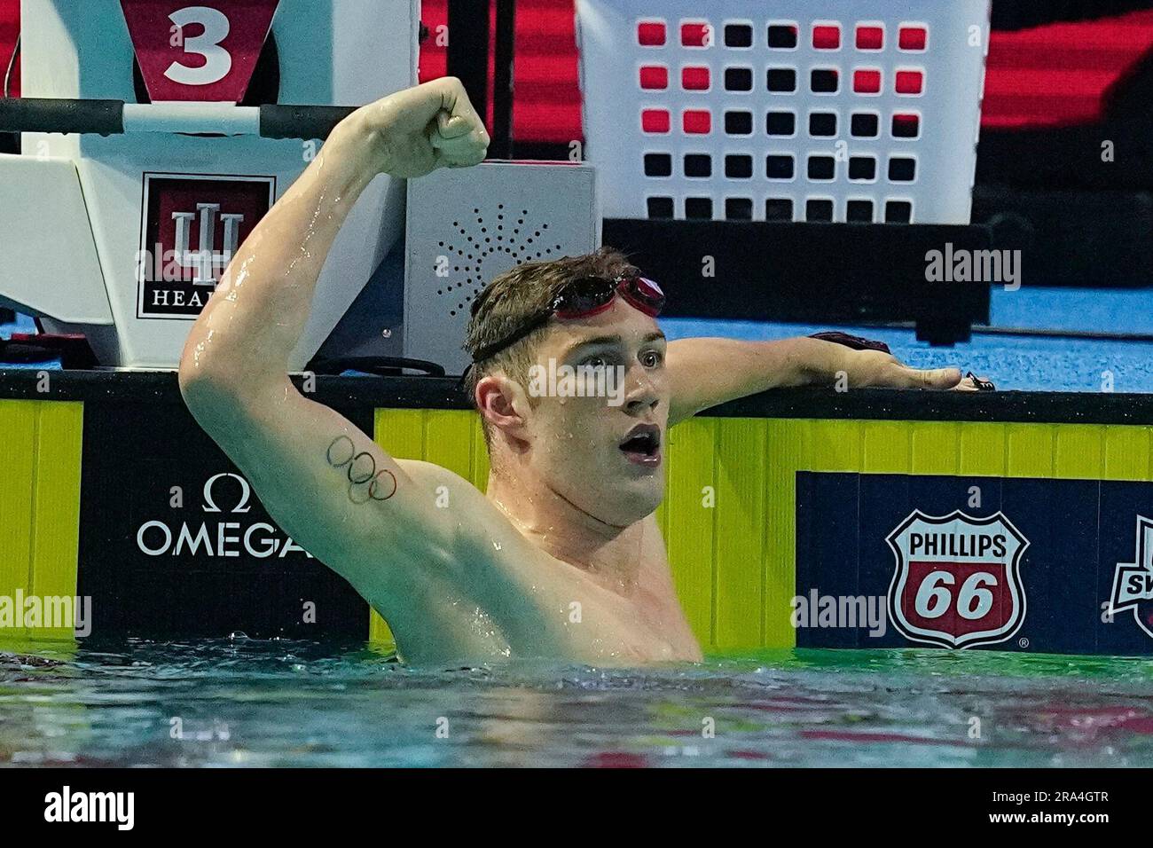 Hunter Armstrong reacts after winning the men's 100-meter backstroke at ...
